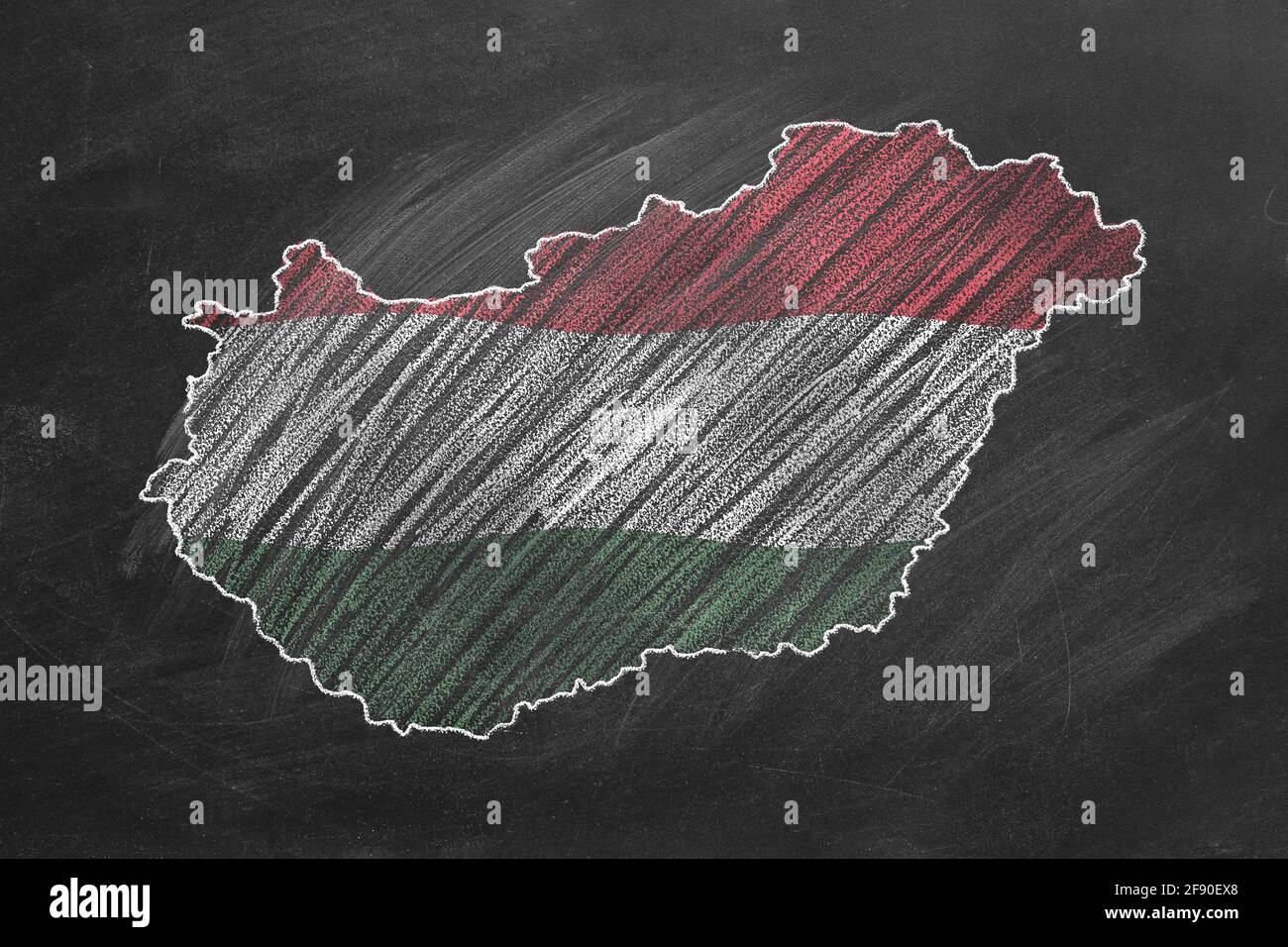 Country map and flag of Hungary drawing with chalk on a blackboard. One ...