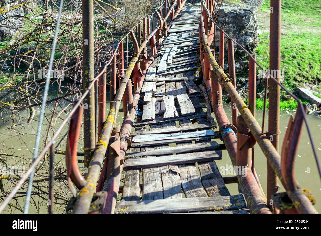 Rickety Bridge For Pedestrian Passing Across The River Trekking With