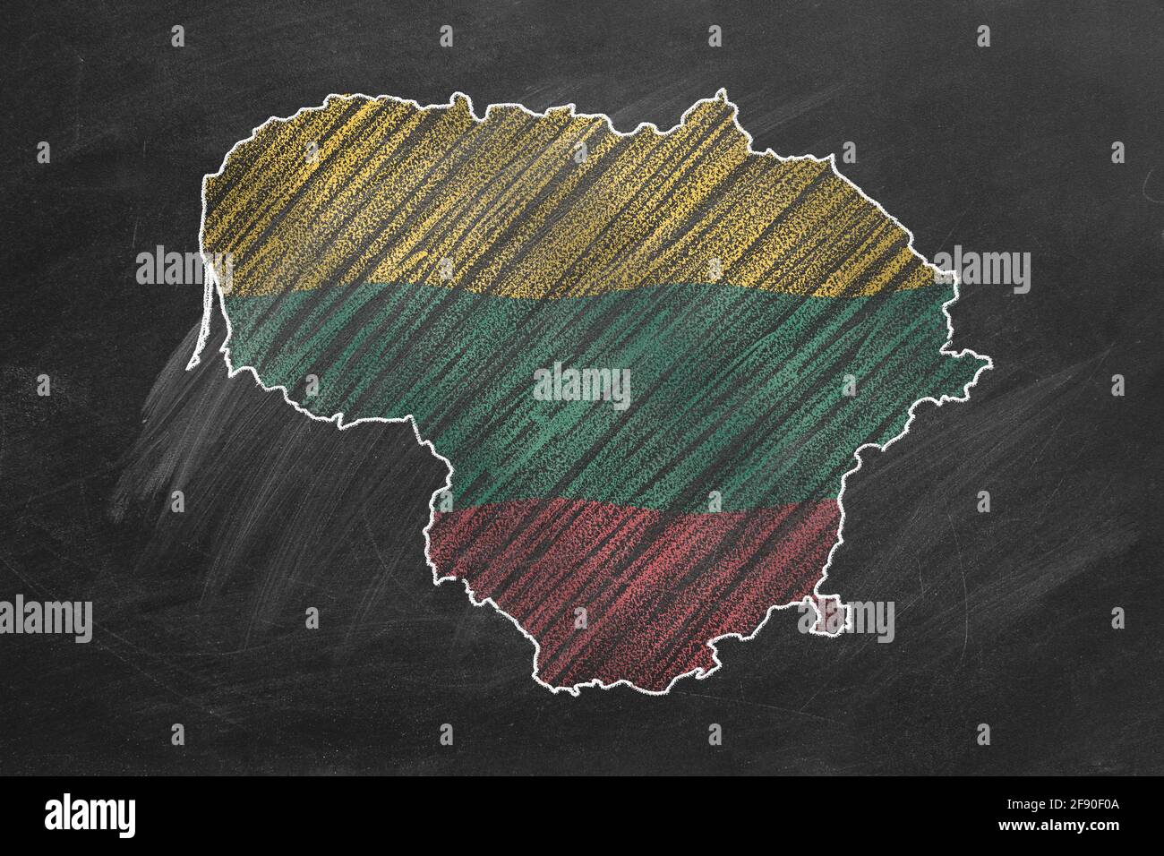 Country map and flag of Lithuania drawing with chalk on a blackboard ...