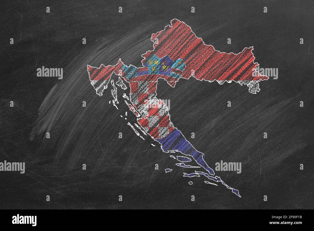 Country map and flag of Croatia drawing with chalk on a blackboard. One ...