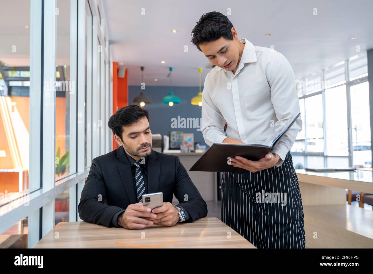 Retail staff apron hi-res stock photography and images - Alamy