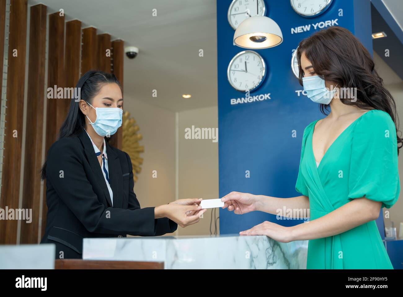 Young client at hotel reception hi-res stock photography and images - Alamy