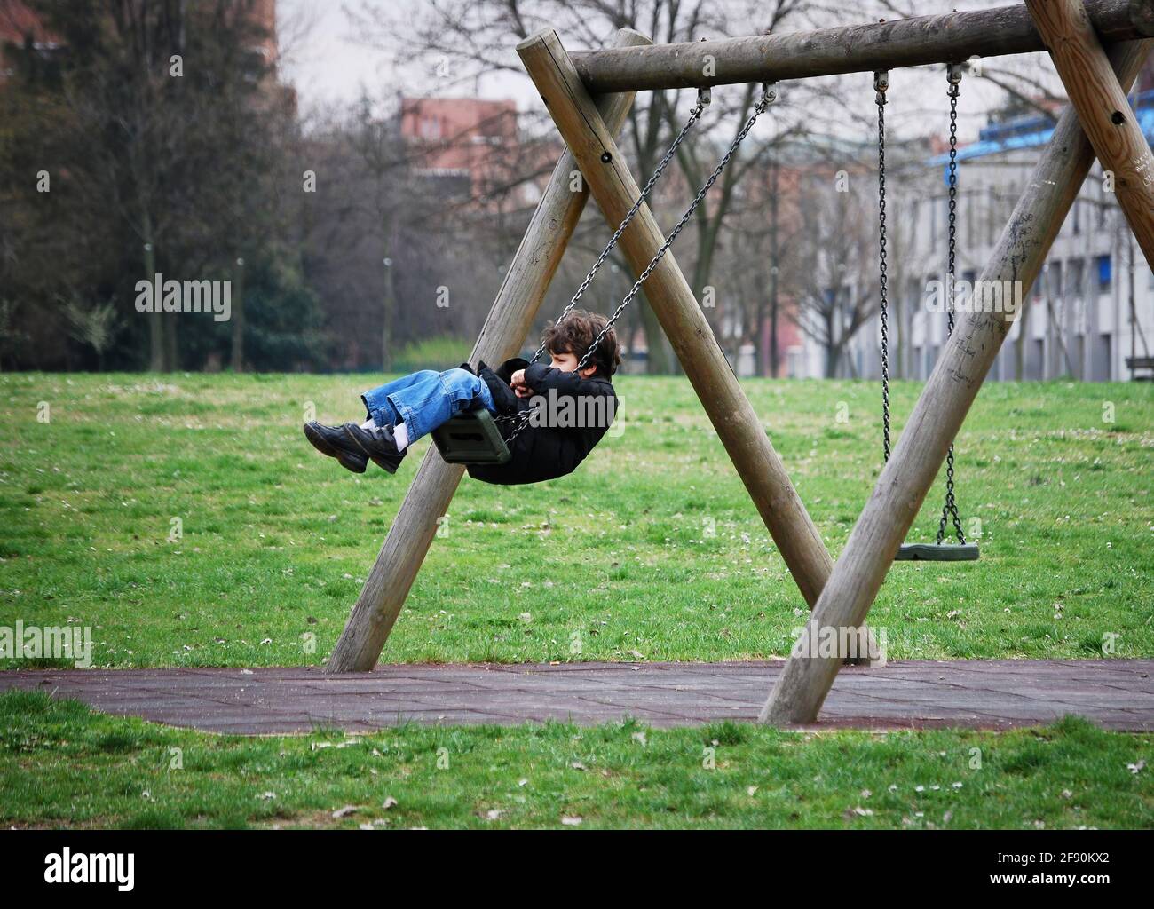 Child Alone In Playground