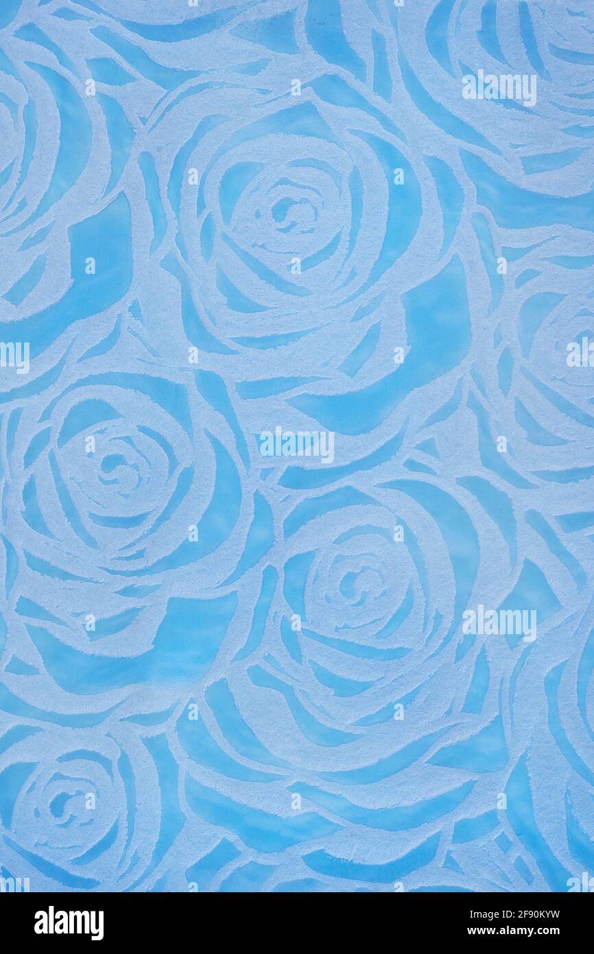 blue background with embossed roses texture Stock Photo - Alamy