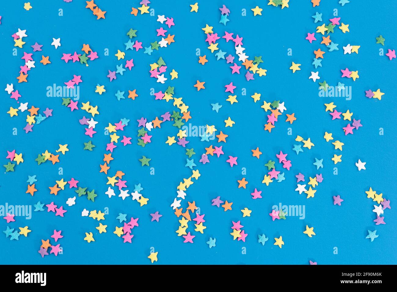 blue background with embossed colored stars texture Stock Photo - Alamy