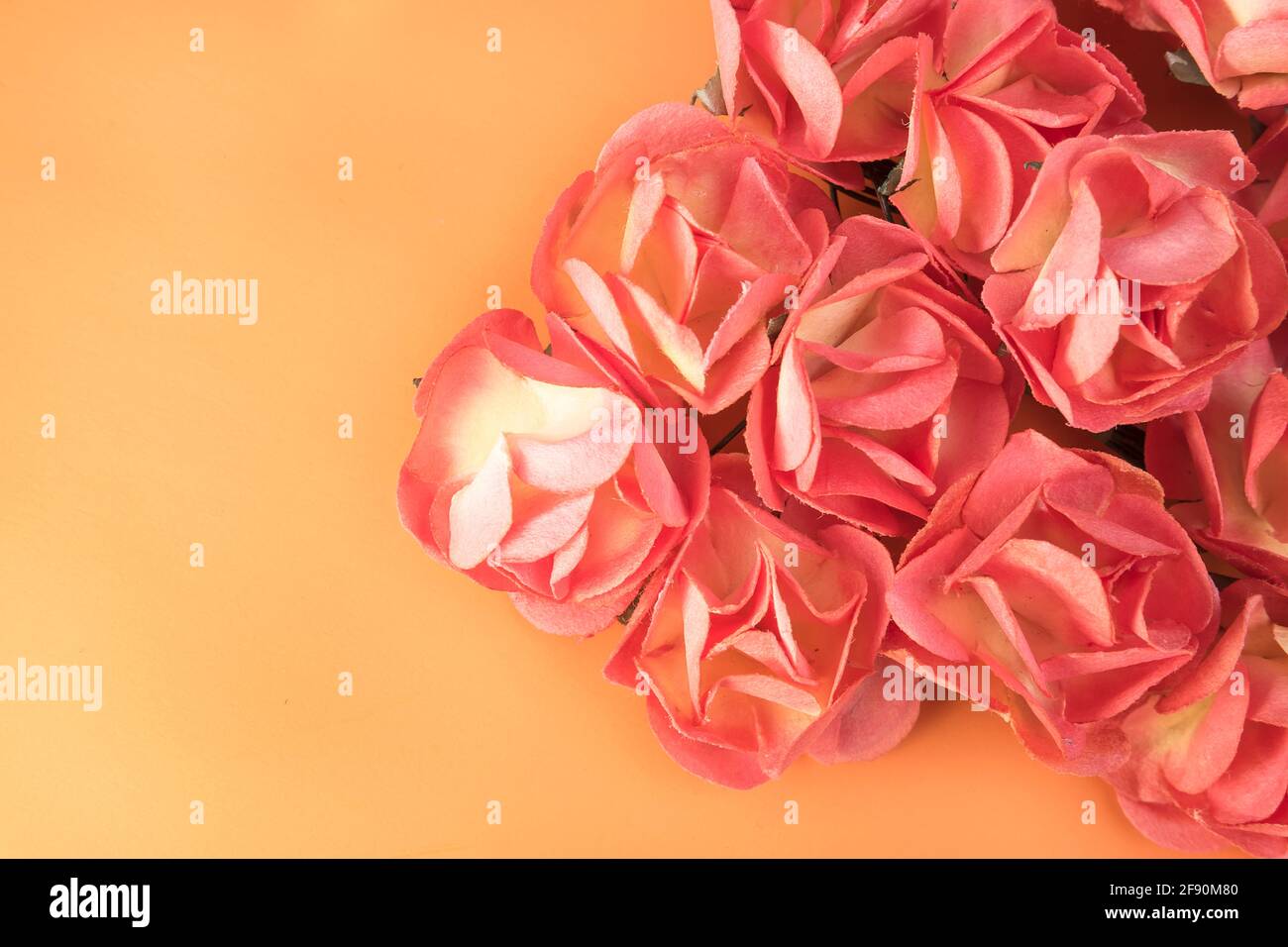 orange background with orange flowers embossed and textured Stock Photo ...