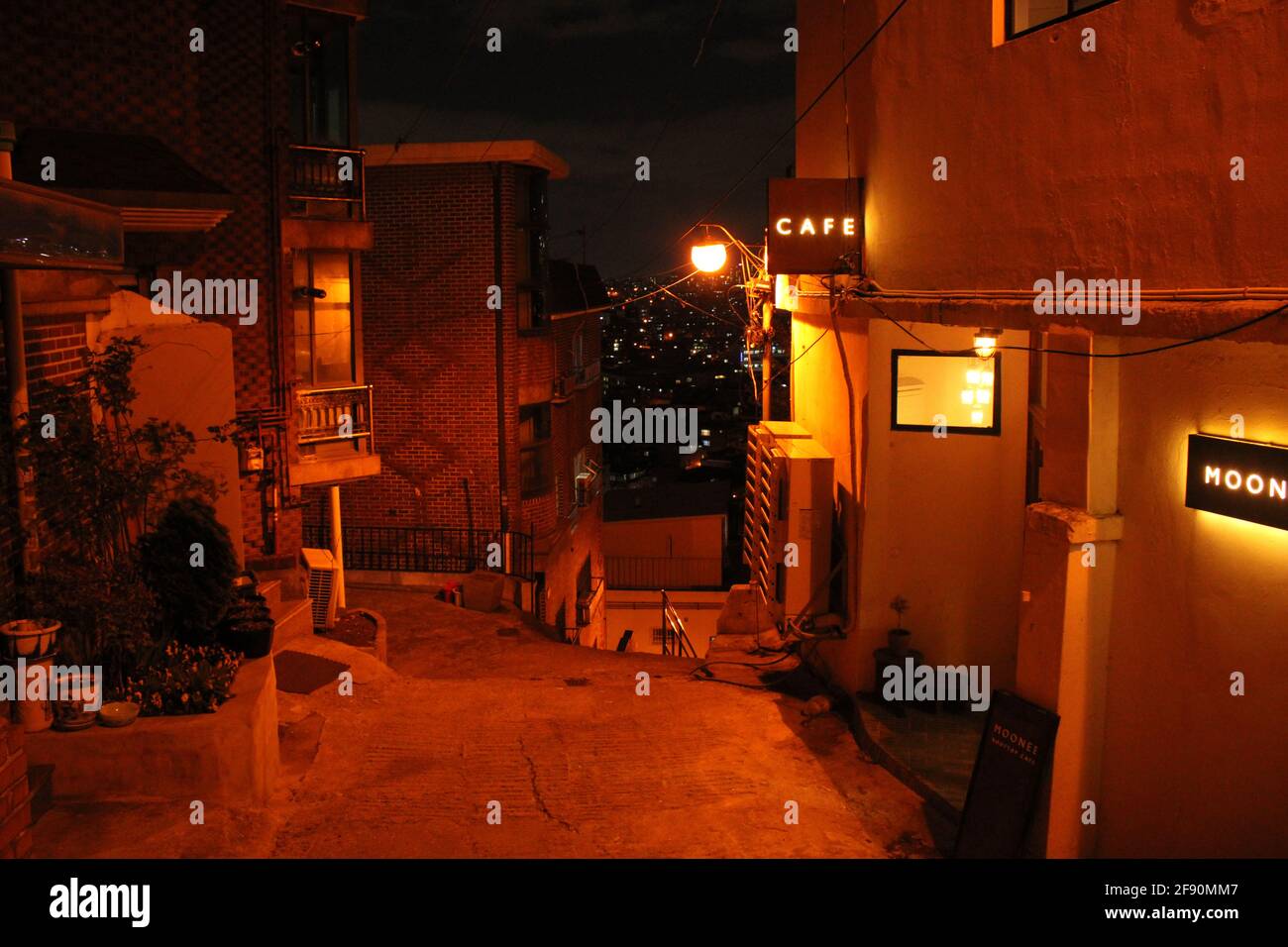 Night view of cafe entrance with Seoul skyline in the background Stock ...