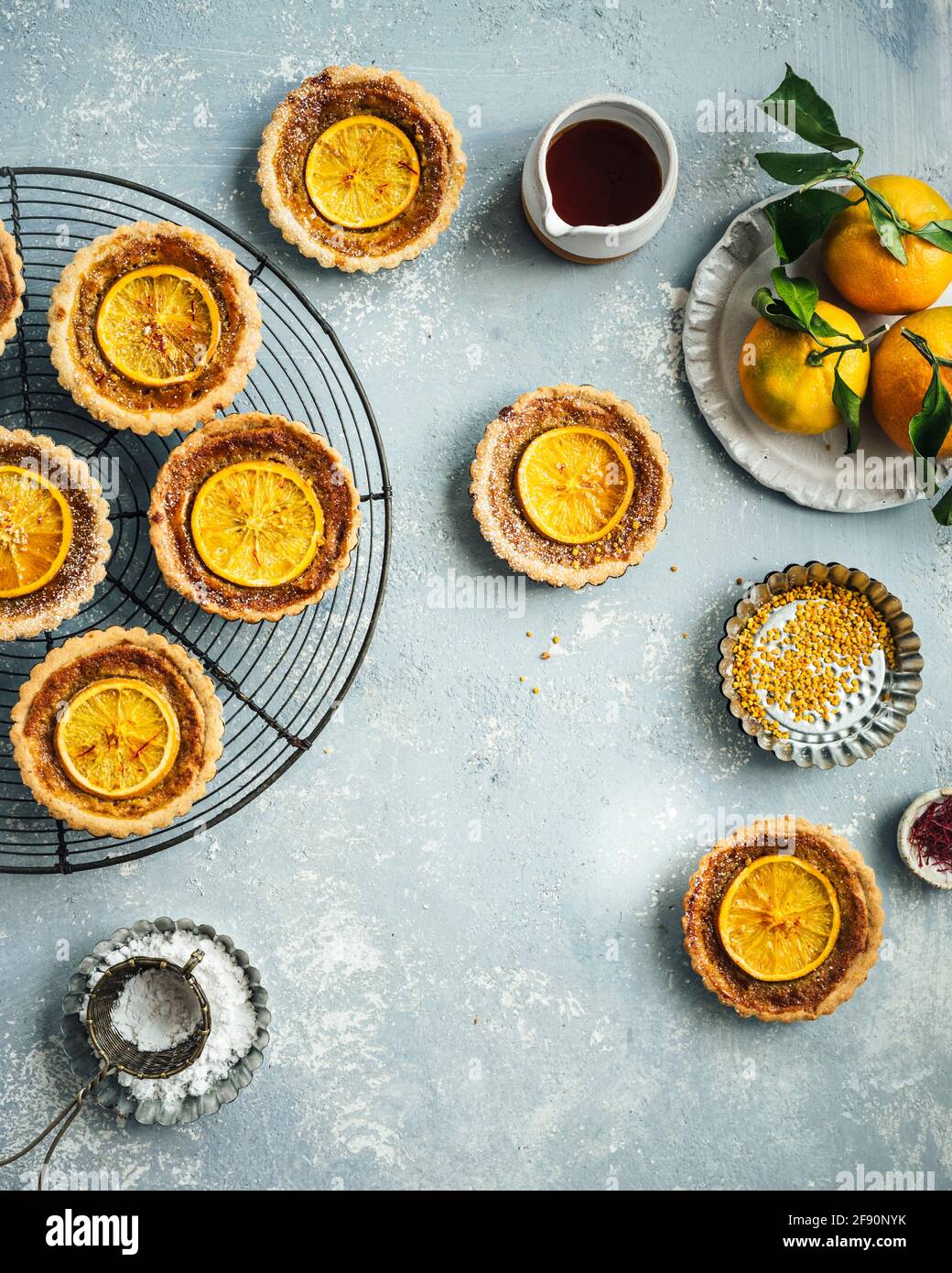 A flatlay of assorted Orange Saffron Frangipane Tarts Stock Photo - Alamy