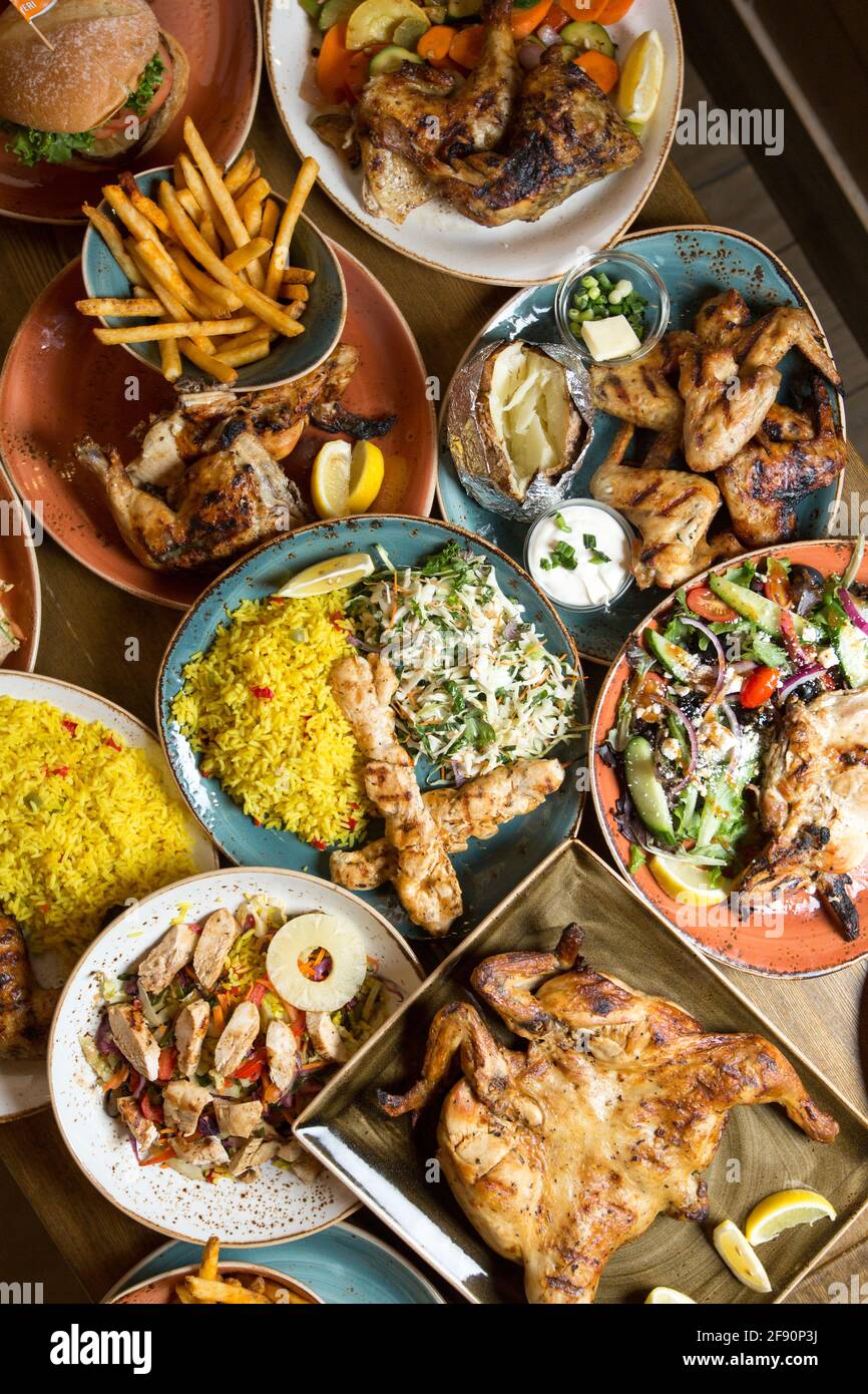 Vertical top view of a restaurant table with many gourmet dishes Stock ...