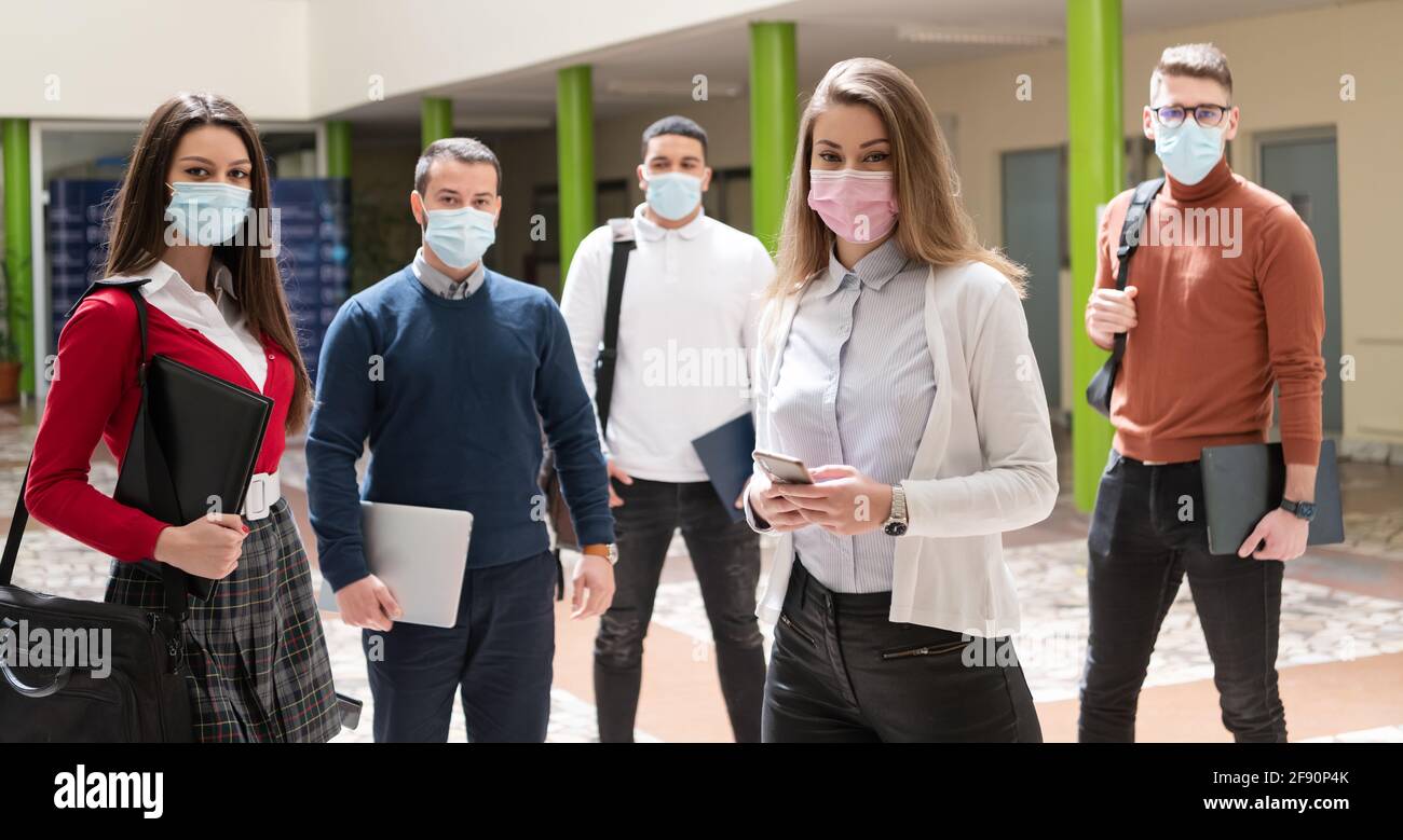 Multiethnic students group wearing protective face mask Stock Photo - Alamy