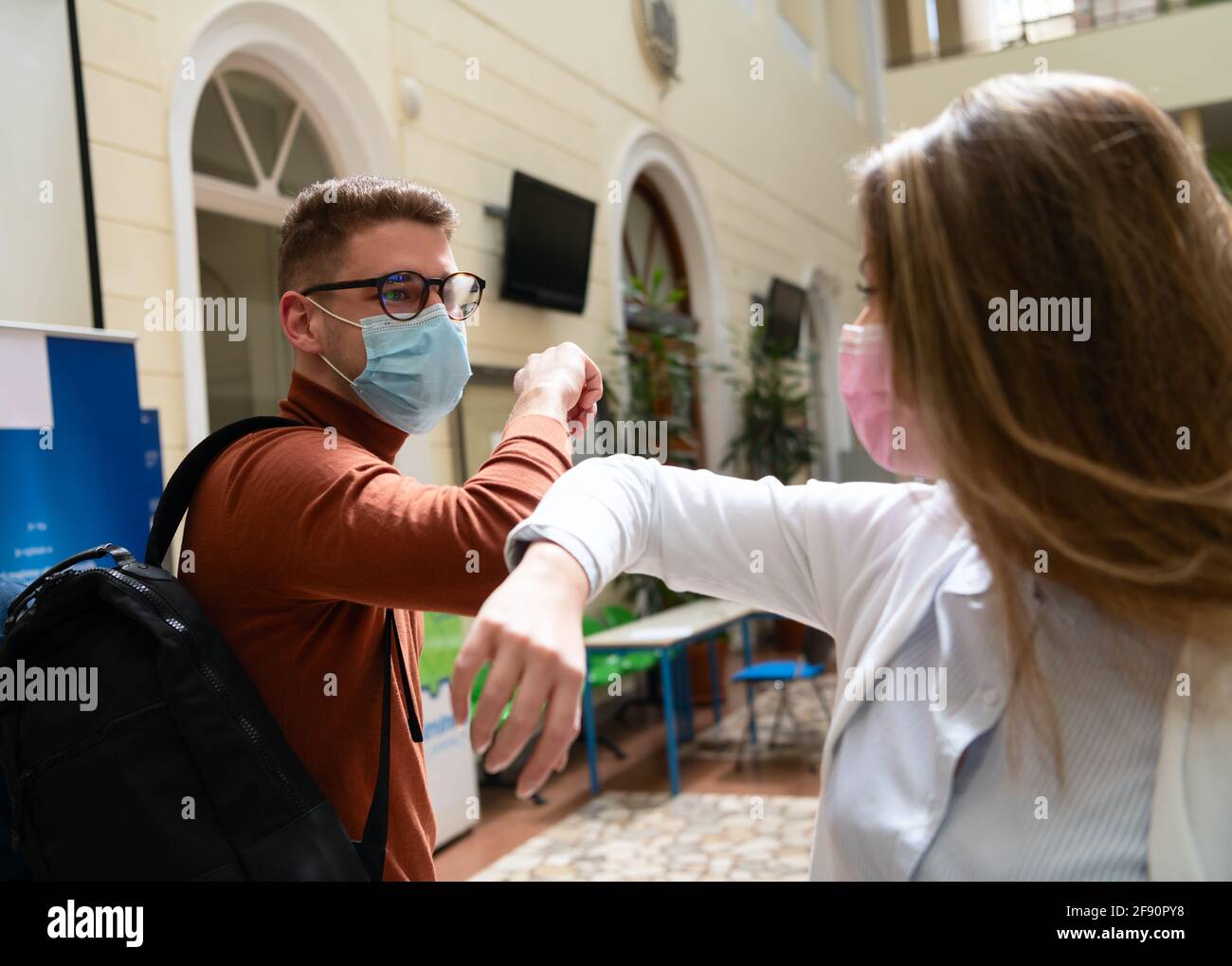 students greeting new normal coronavirus handshake and elbow bumping ...