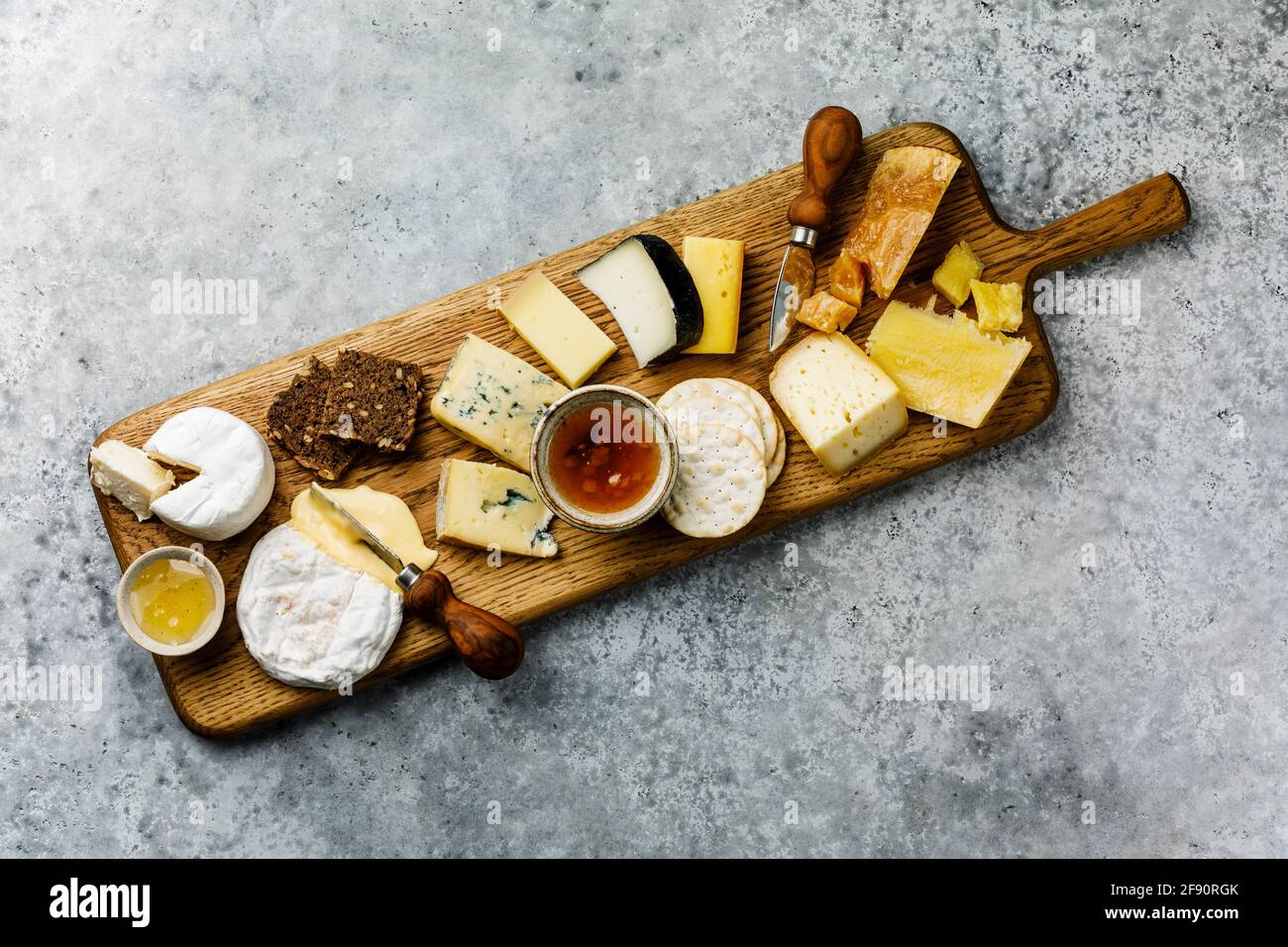 Different types of cheese Snack assortment on wood serving cheese board ...