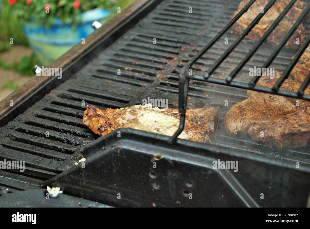 steak on the grill at a backyard cookout Stock Photo - Alamy