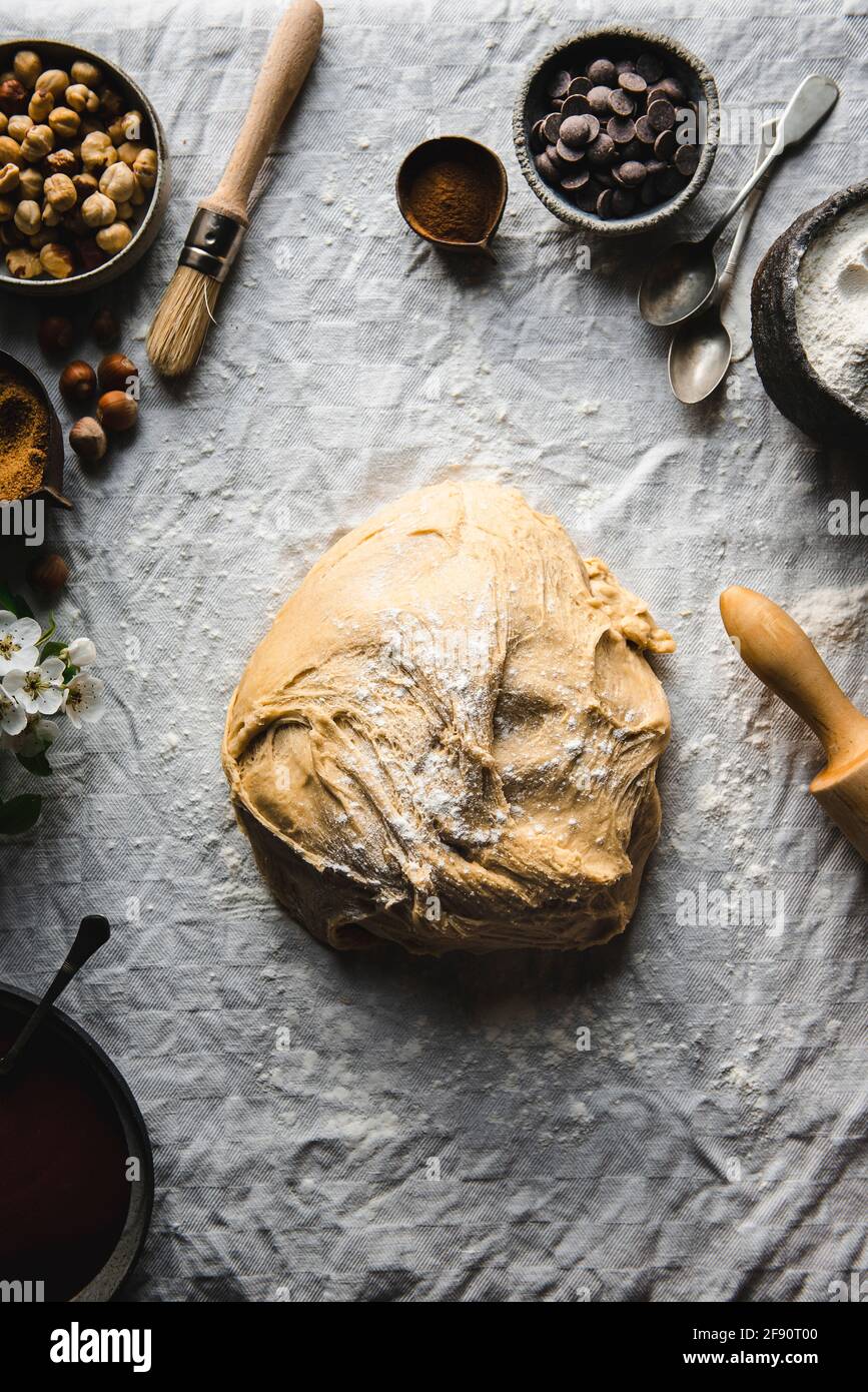 Preparation process of dough and ingredients arranged on the table ...