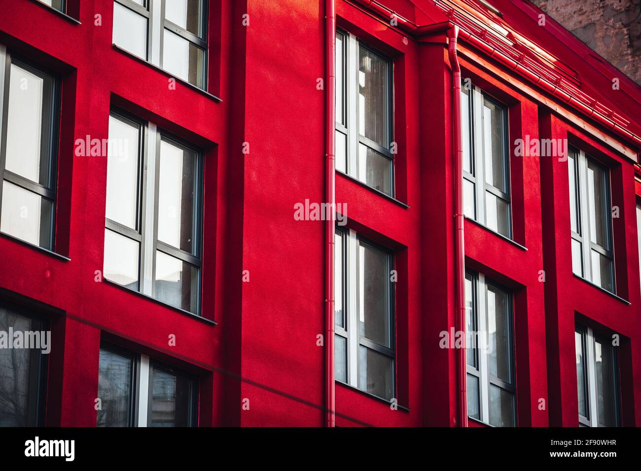 Beautiful view of a detail of a red architecture with windows in the ...