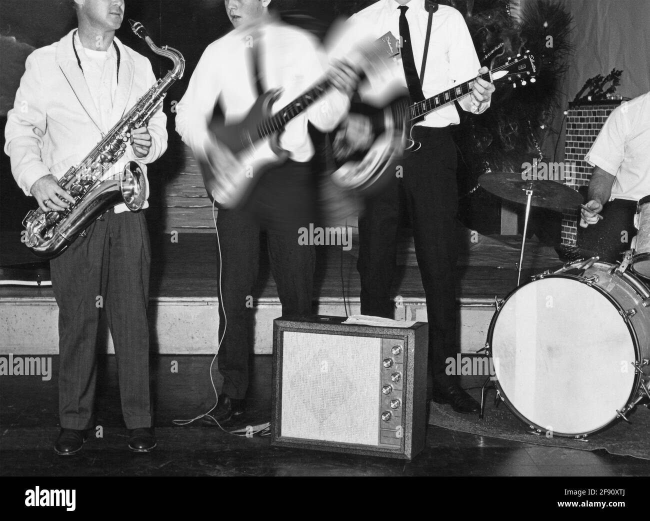 A vintage late 1950s or early 1960s photograph of a college rock and ...