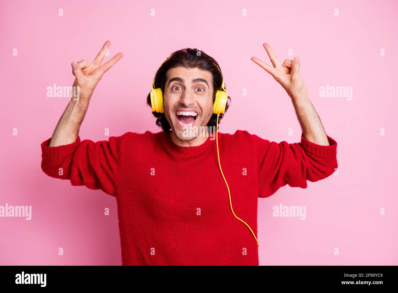 Photo of young handsome man excited happy positive smile listen music ...