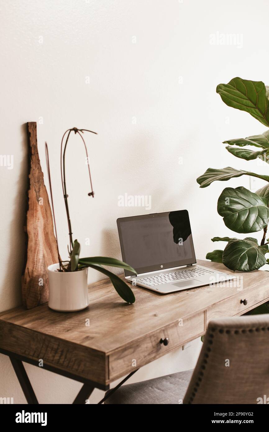 Working remotely - work from home concept. Living room office with ...