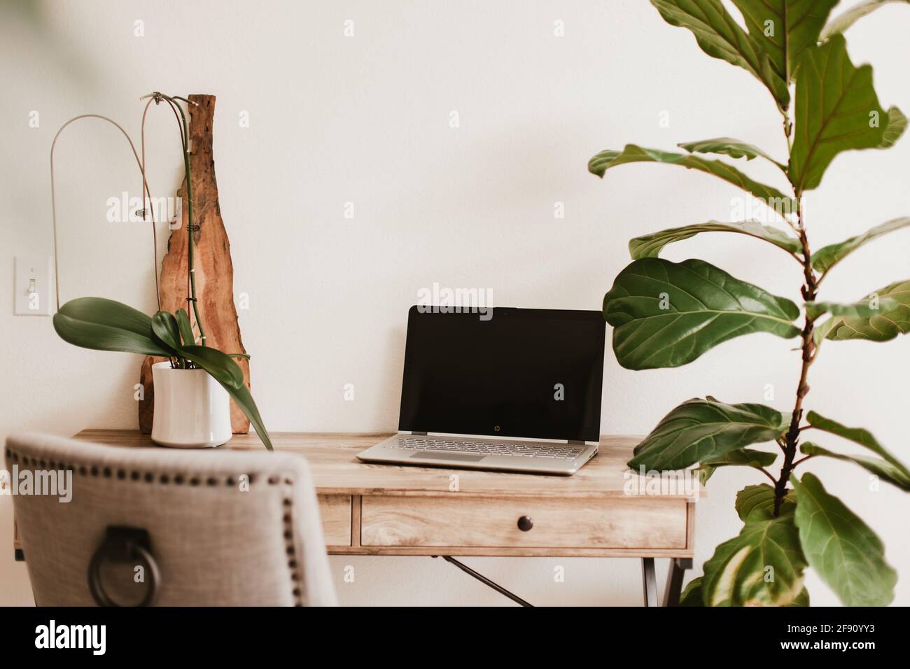 Working remotely - work from home concept. Living room office with ...
