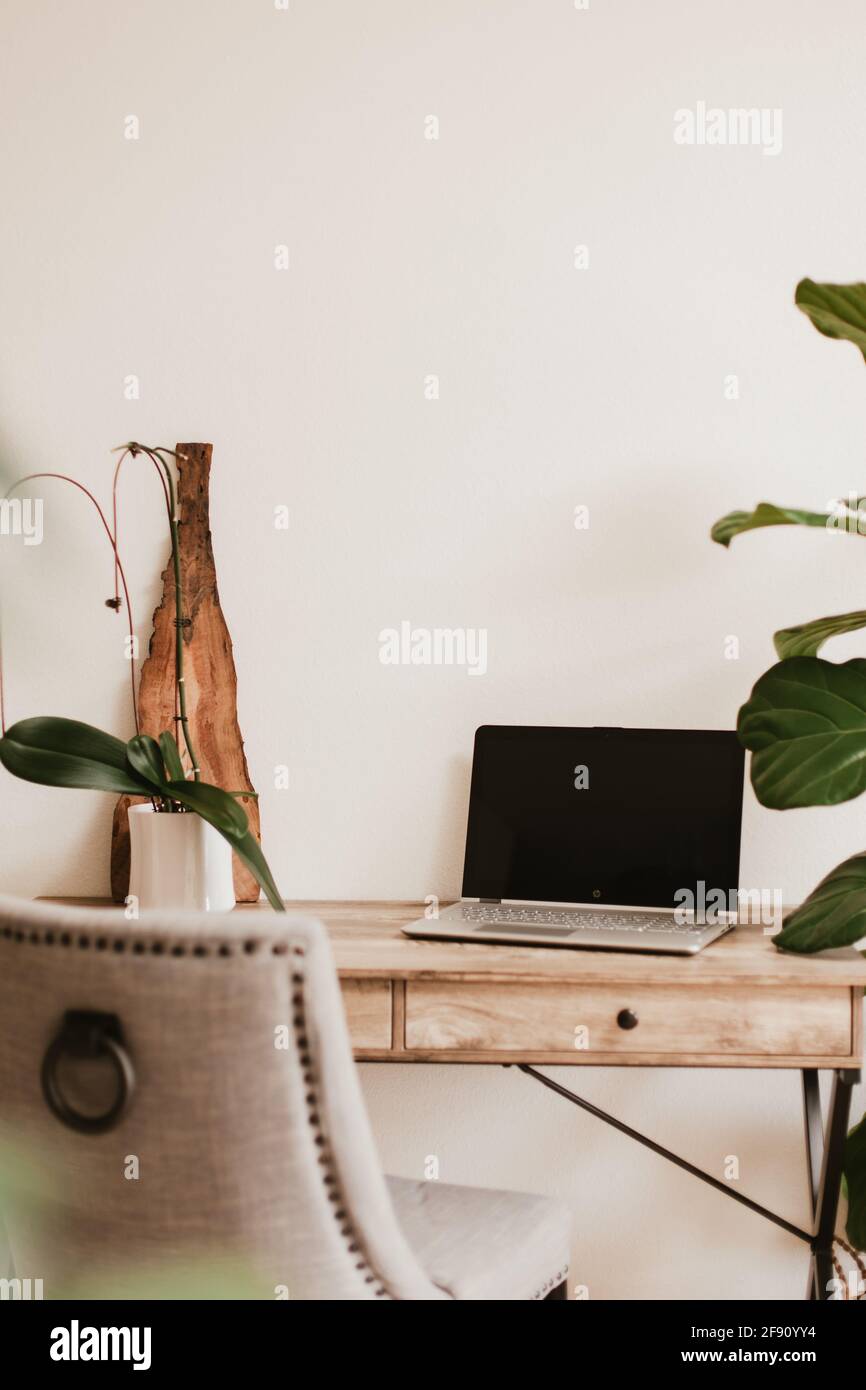 Working remotely - work from home concept. Living room office with ...