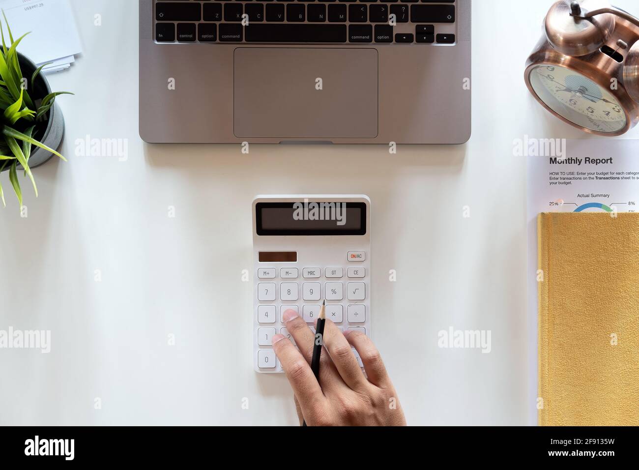 Top view hand of accountant using calculator on workplace with copy ...