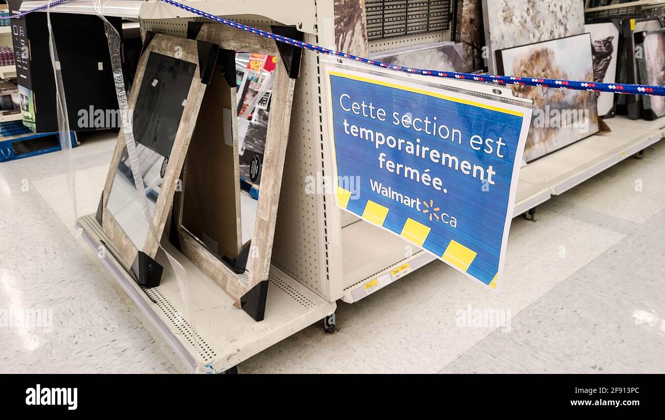 Tape closing off non-essential shopping items in a major supermarket. A ...