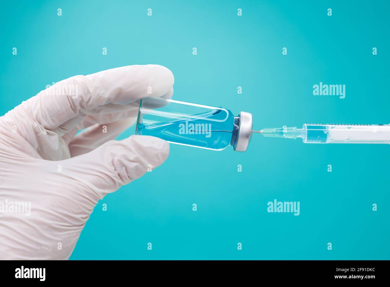 Immunity against diseases. Medical syringe with blue liquid Stock Photo ...
