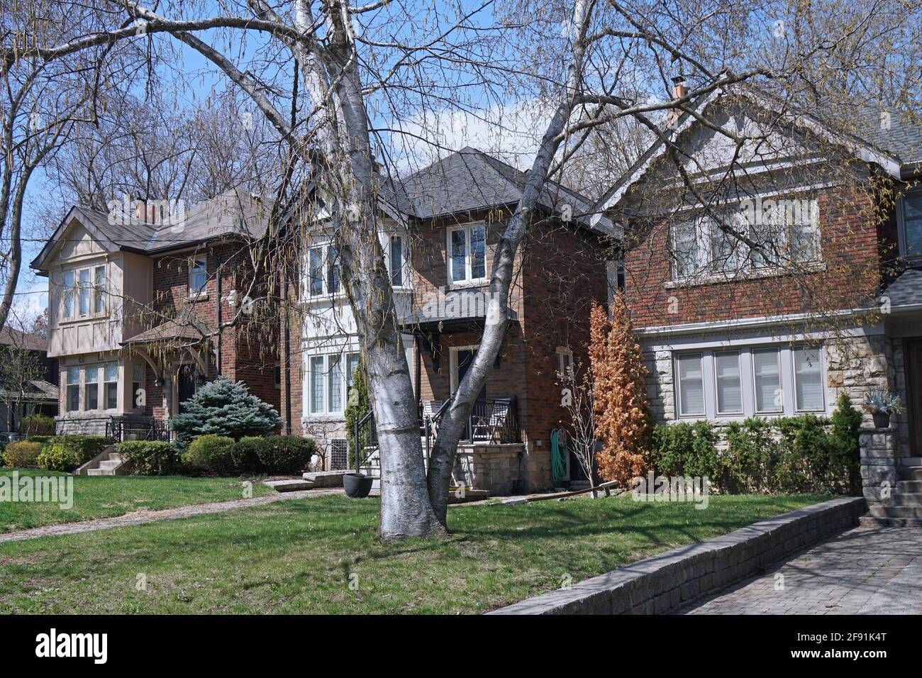 Residential street with traditional single family detached houses Stock ...