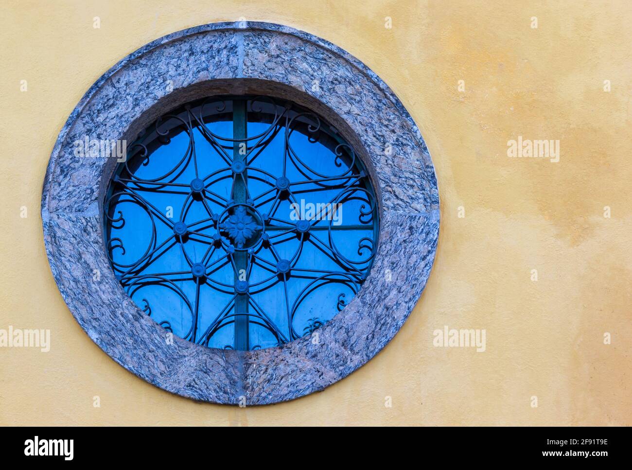 Round vintage window on an orange wall Stock Photo - Alamy