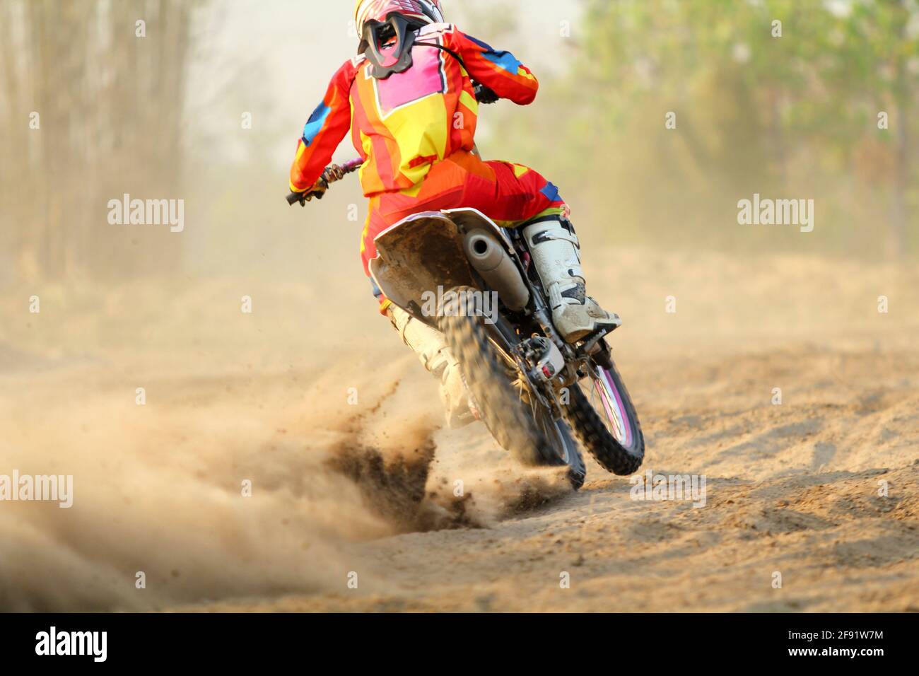 Motocross racer accelerating speed in track Stock Photo - Alamy