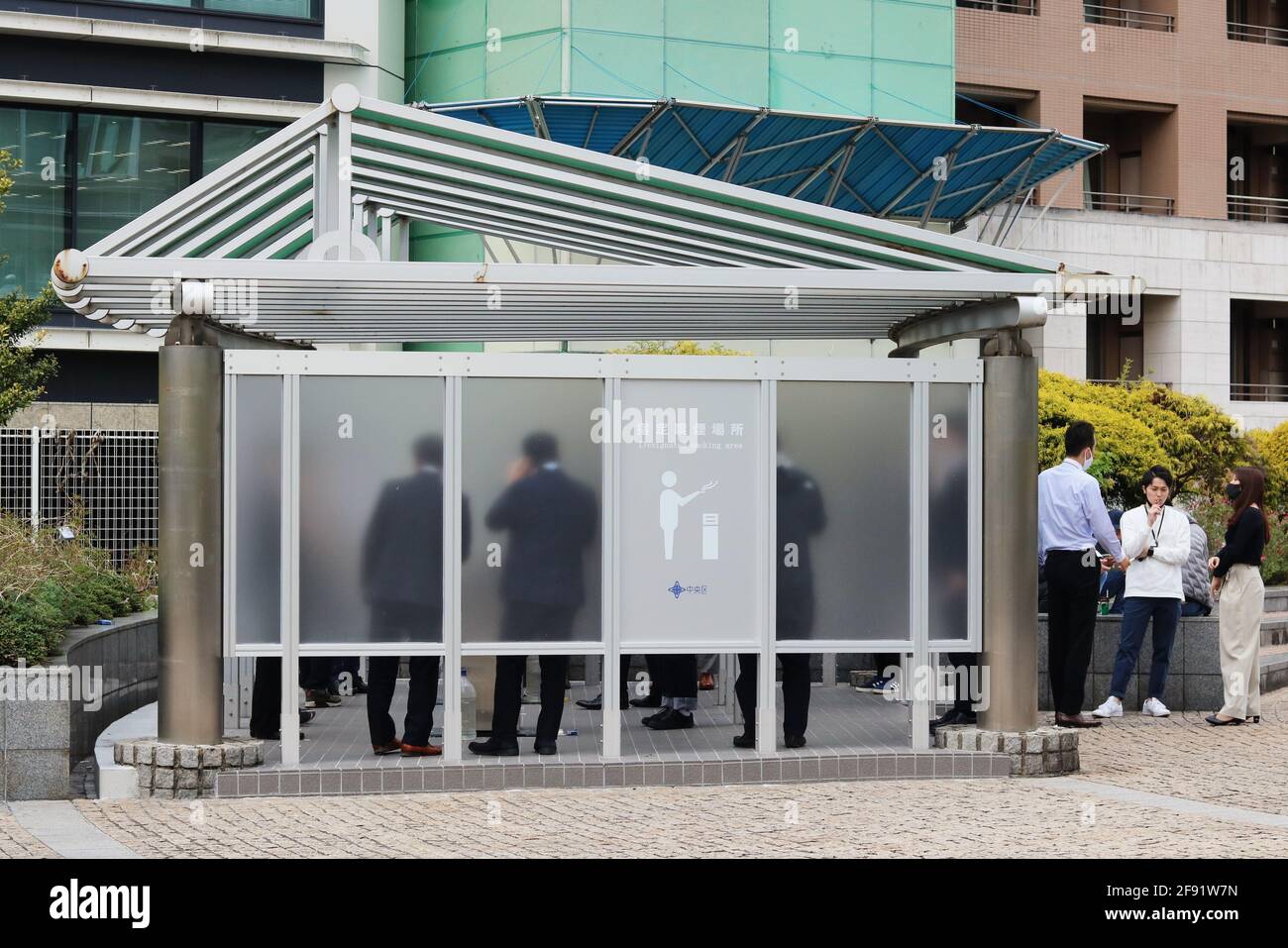 TOKYO, JAPAN - April 8, 2021: A partitioned designated smoking area in ...