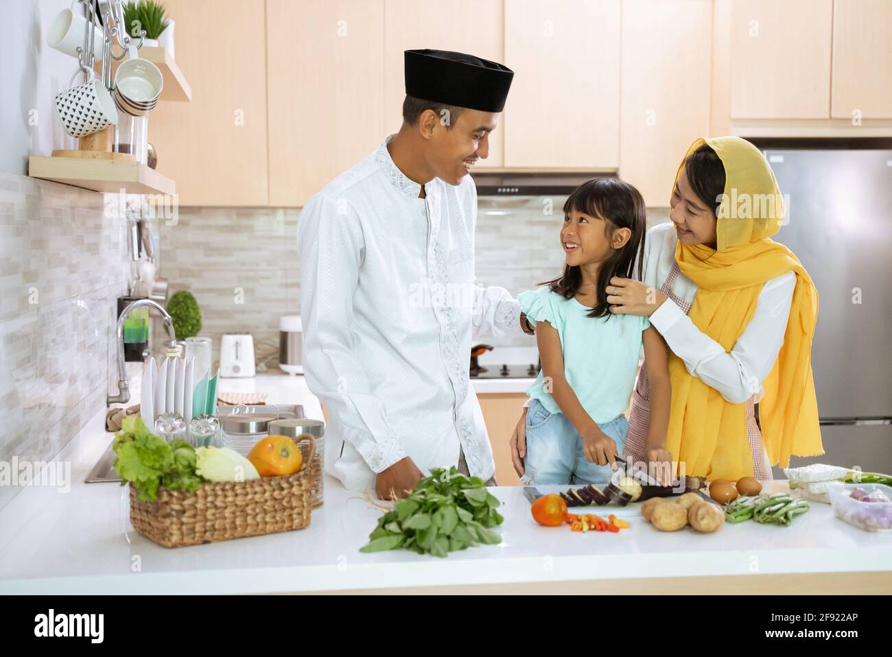 beautiful muslim asian family cooking for iftar dinner together at home ...