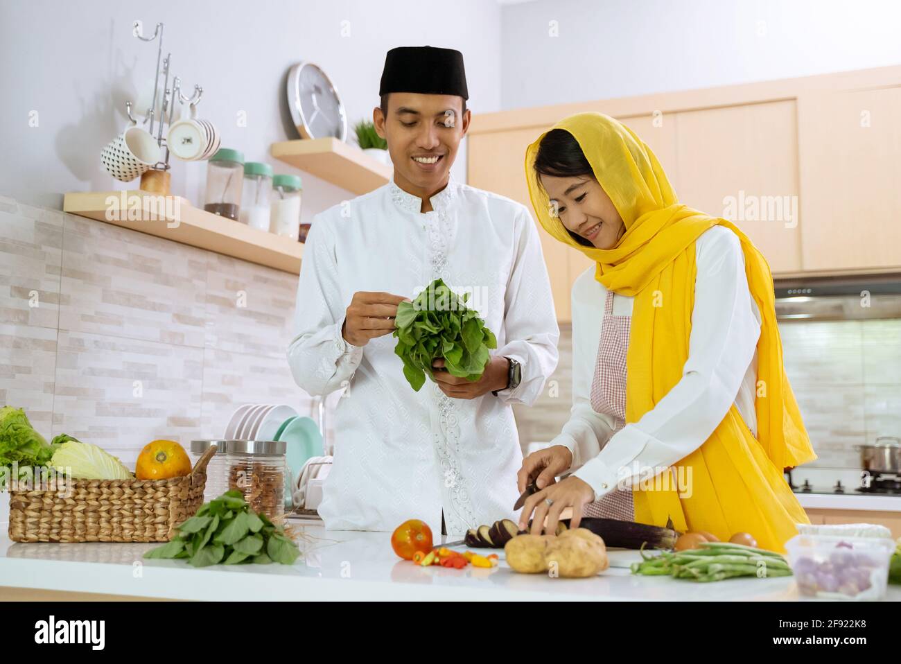 happy muslim couple cooking together in the kitchen Stock Photo - Alamy