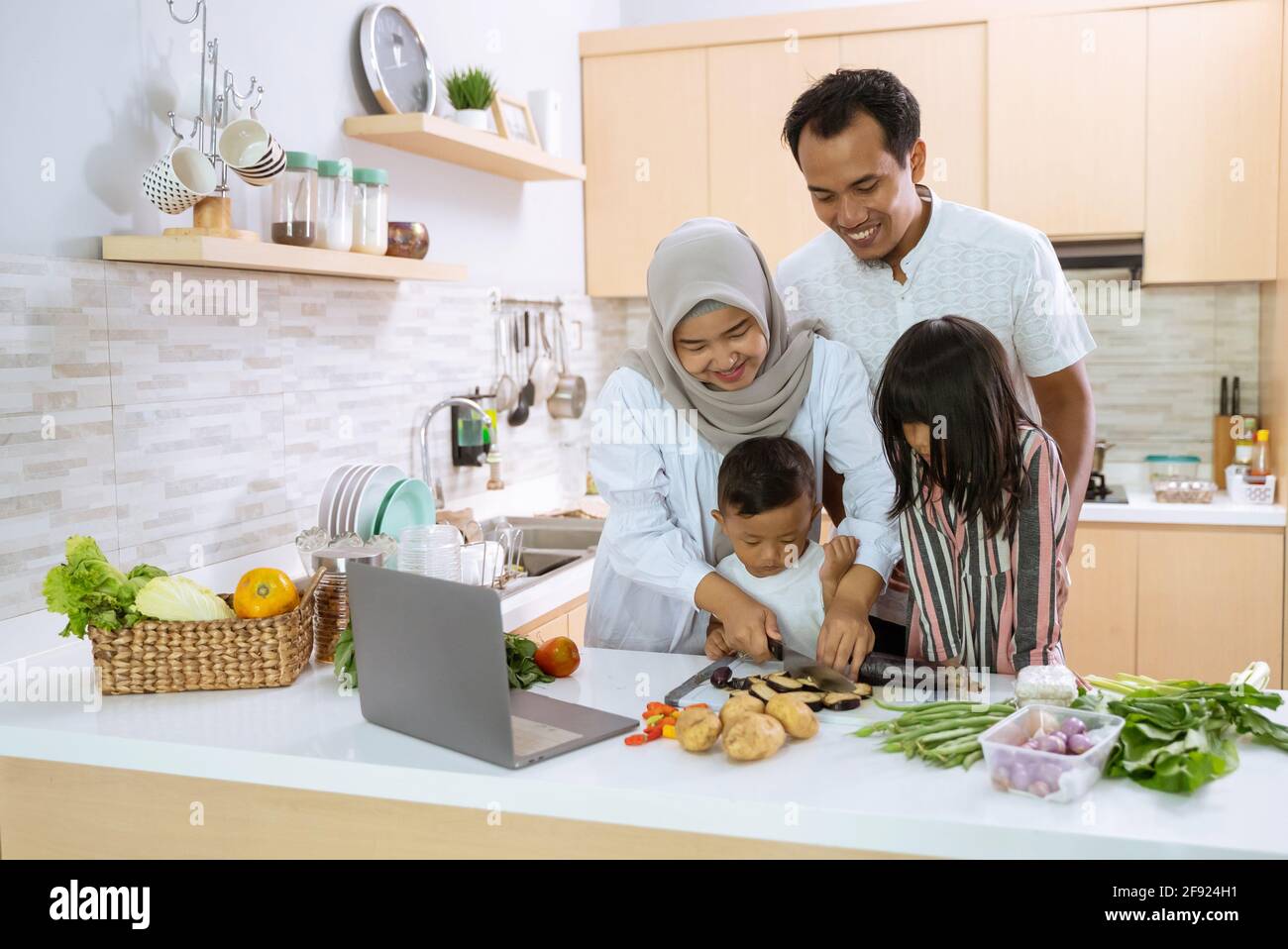 muslim parent and kids enjoy cooking iftar dinner together during ...