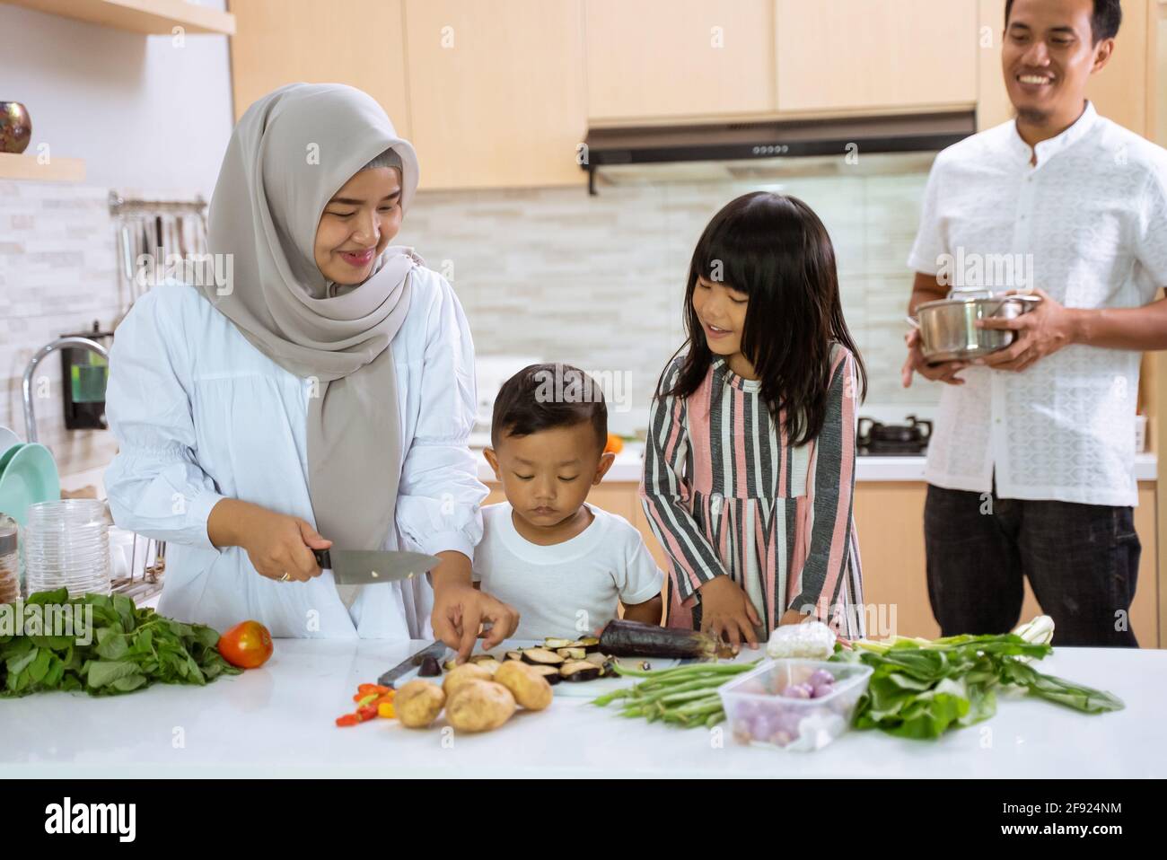 muslim parent and kids enjoy cooking iftar dinner together during ...