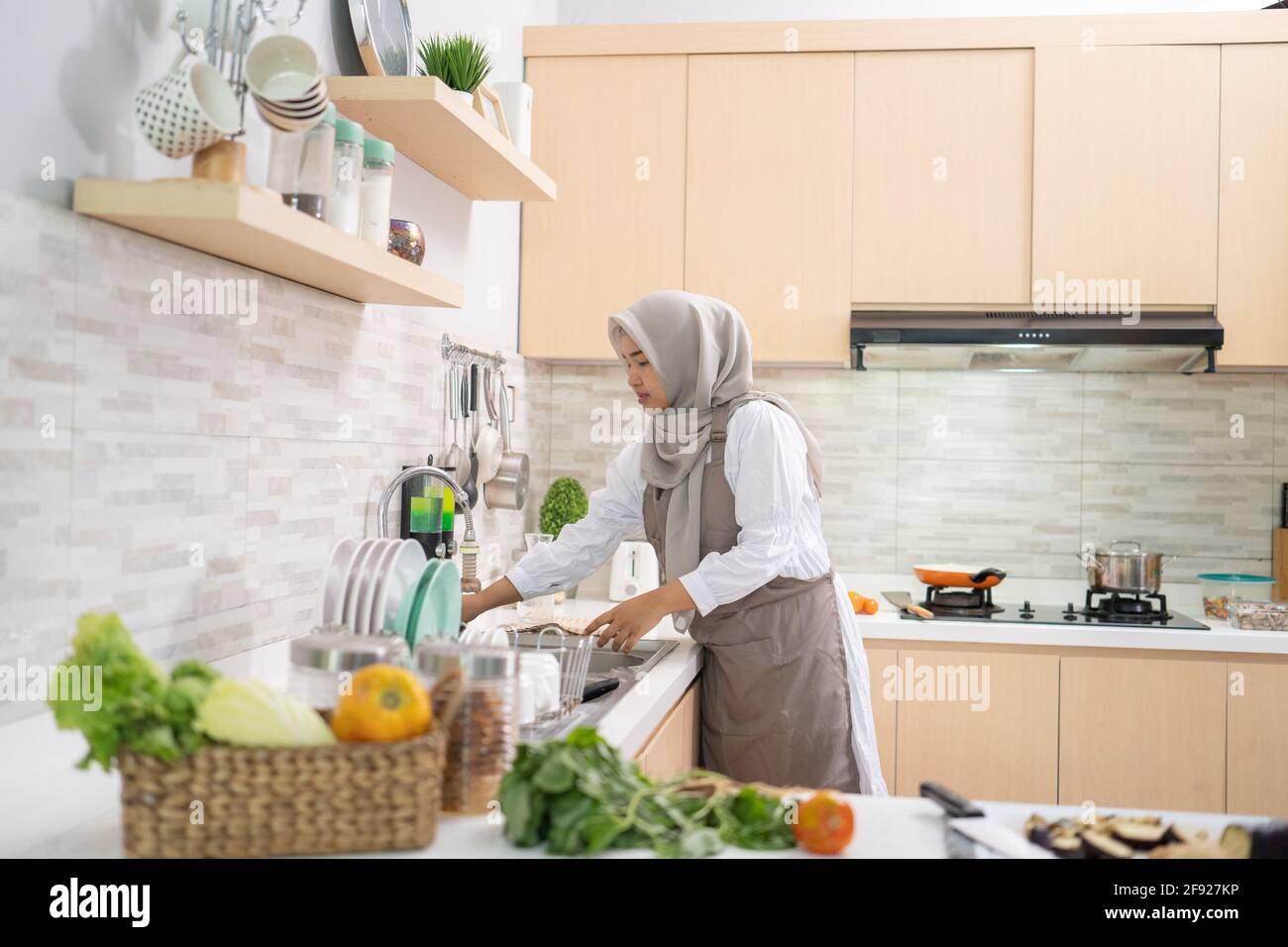 muslim housewife prepare for cooking in the kitchen Stock Photo - Alamy