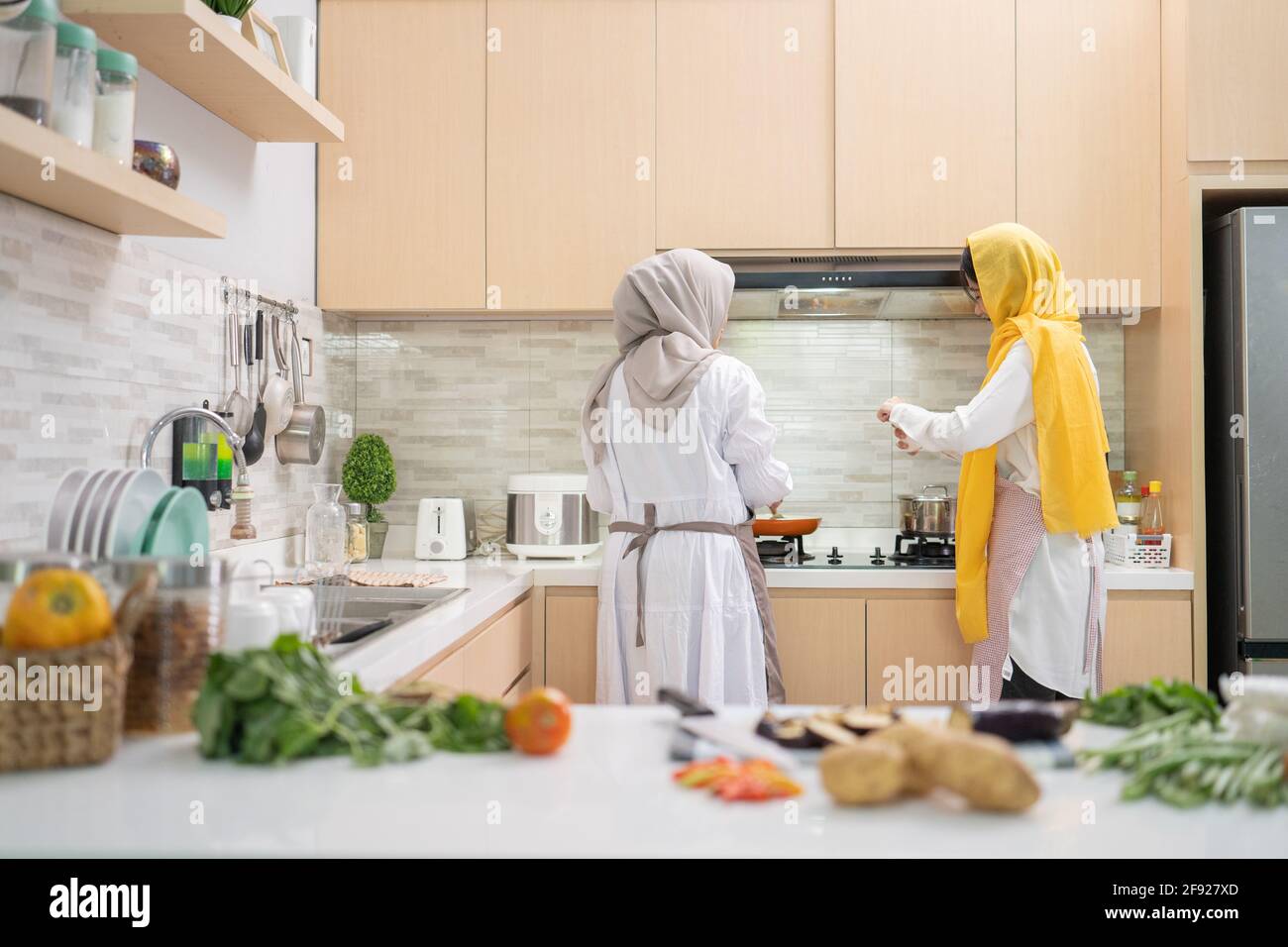 muslim woman having fun while cooking together in the kitchen Stock ...