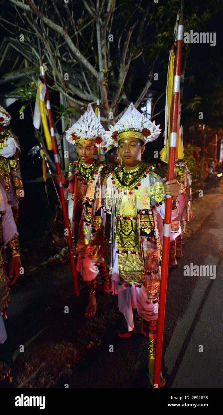 Balinese male dancers dancing during a temple festival in Ubud, Bali ...