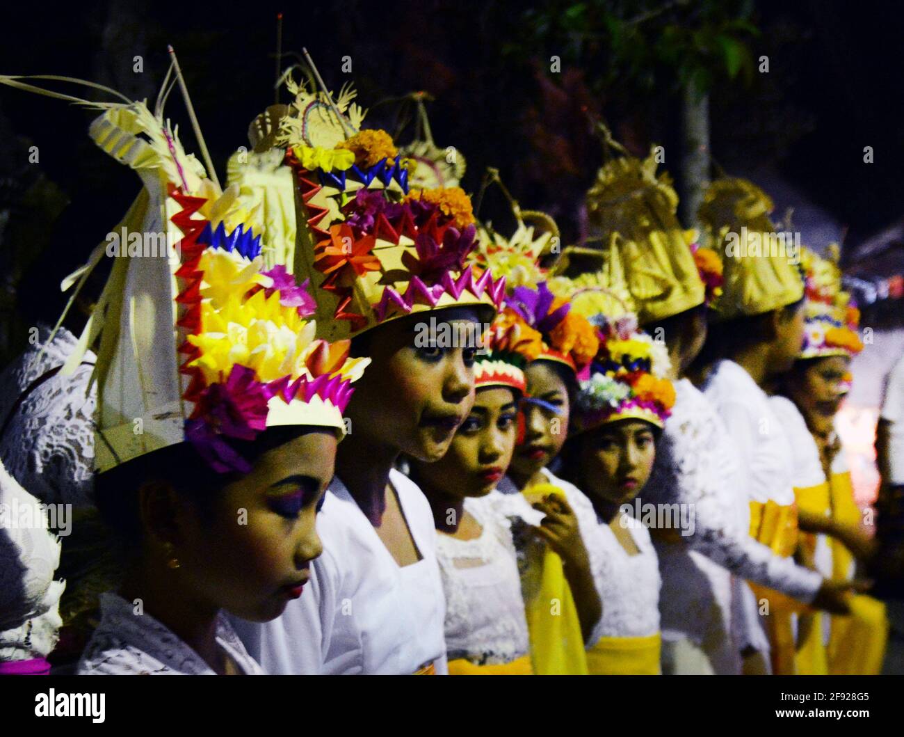 Balinese girl dancers performing at a cultural temple festival in Ubud ...