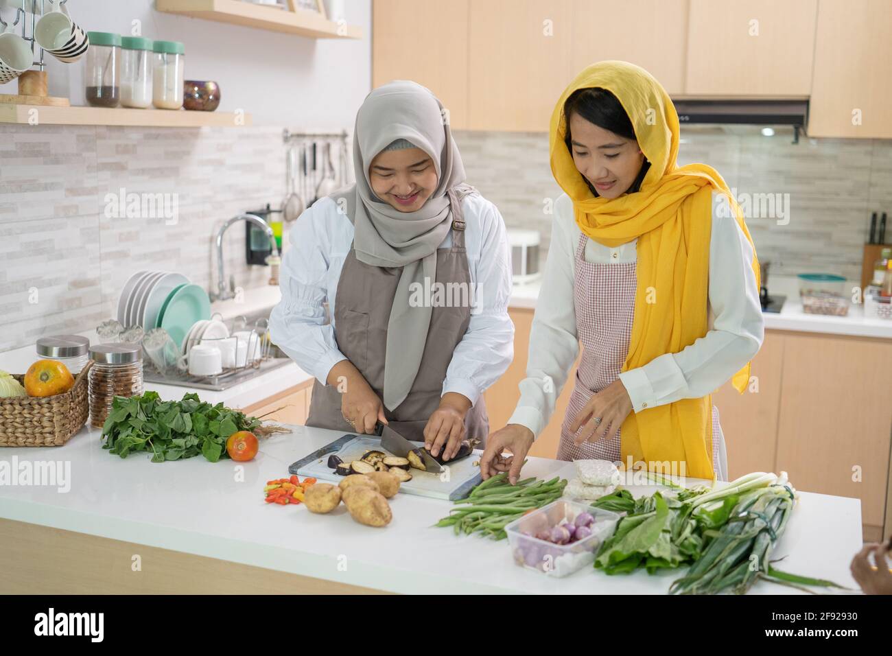 muslim woman enjoy cooking dinner together for iftar breaking the fast ...