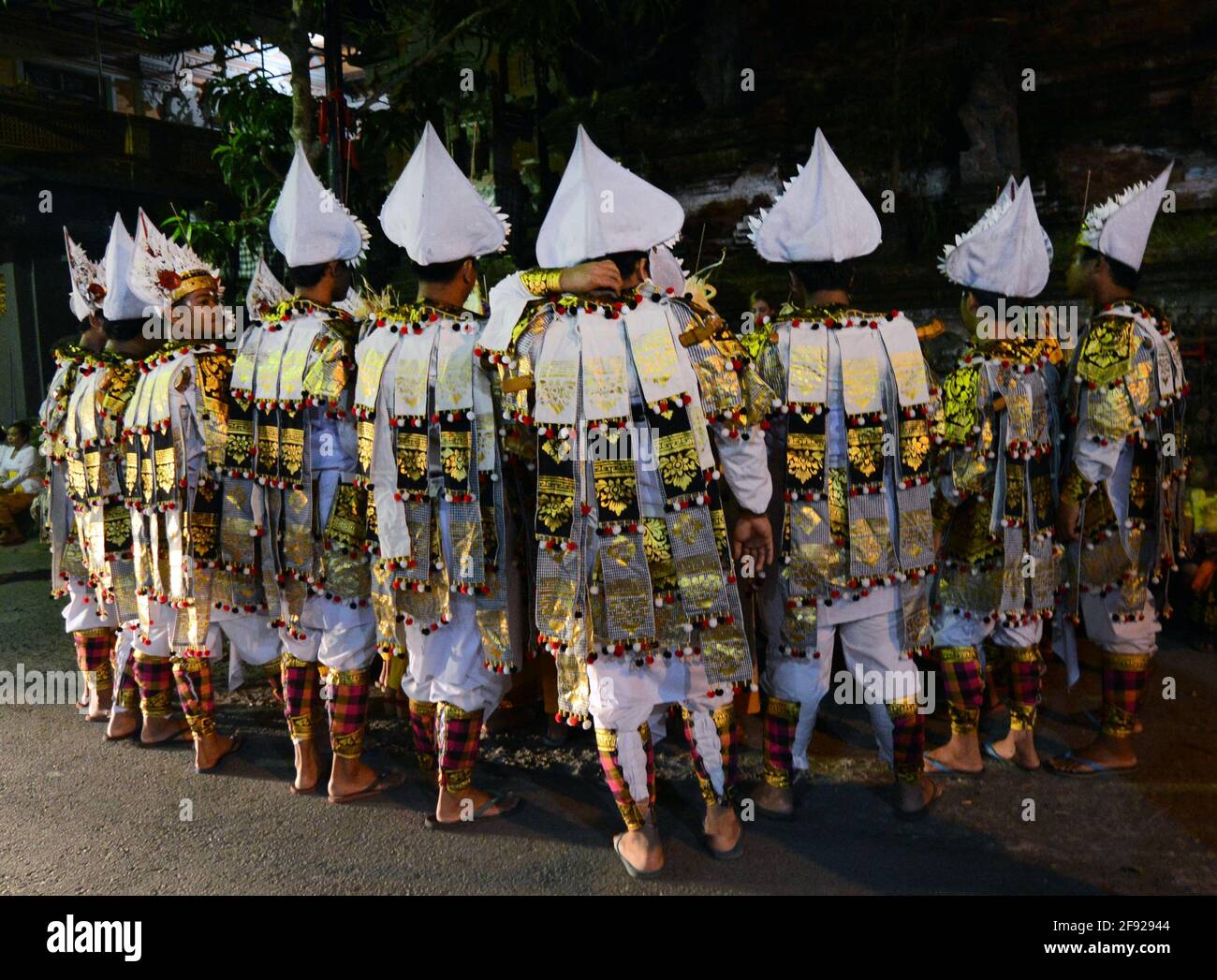 Balinese male dancers dancing during a temple festival in Ubud, Bali ...
