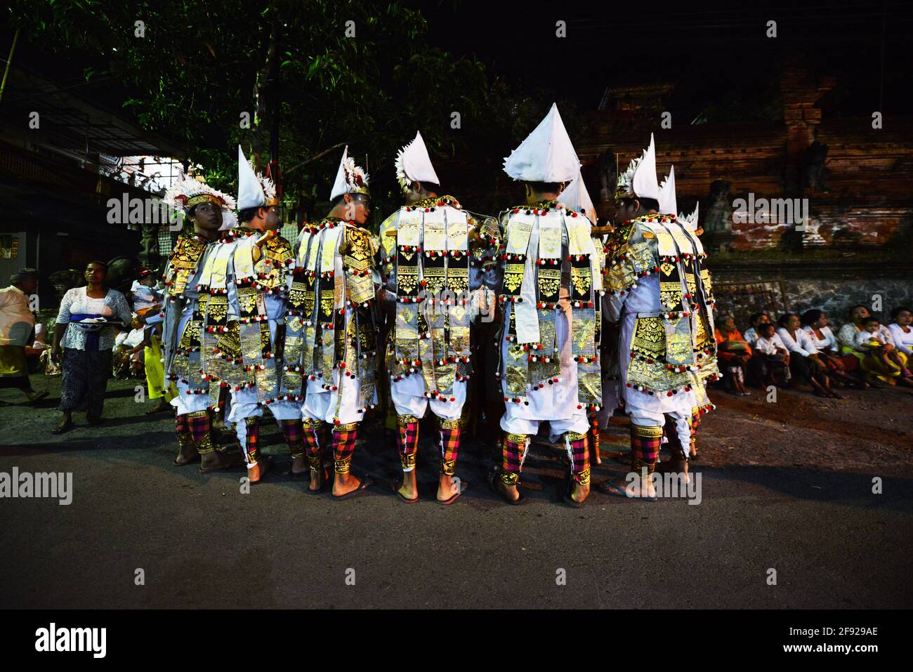 Balinese male dancers dancing during a temple festival in Ubud, Bali ...