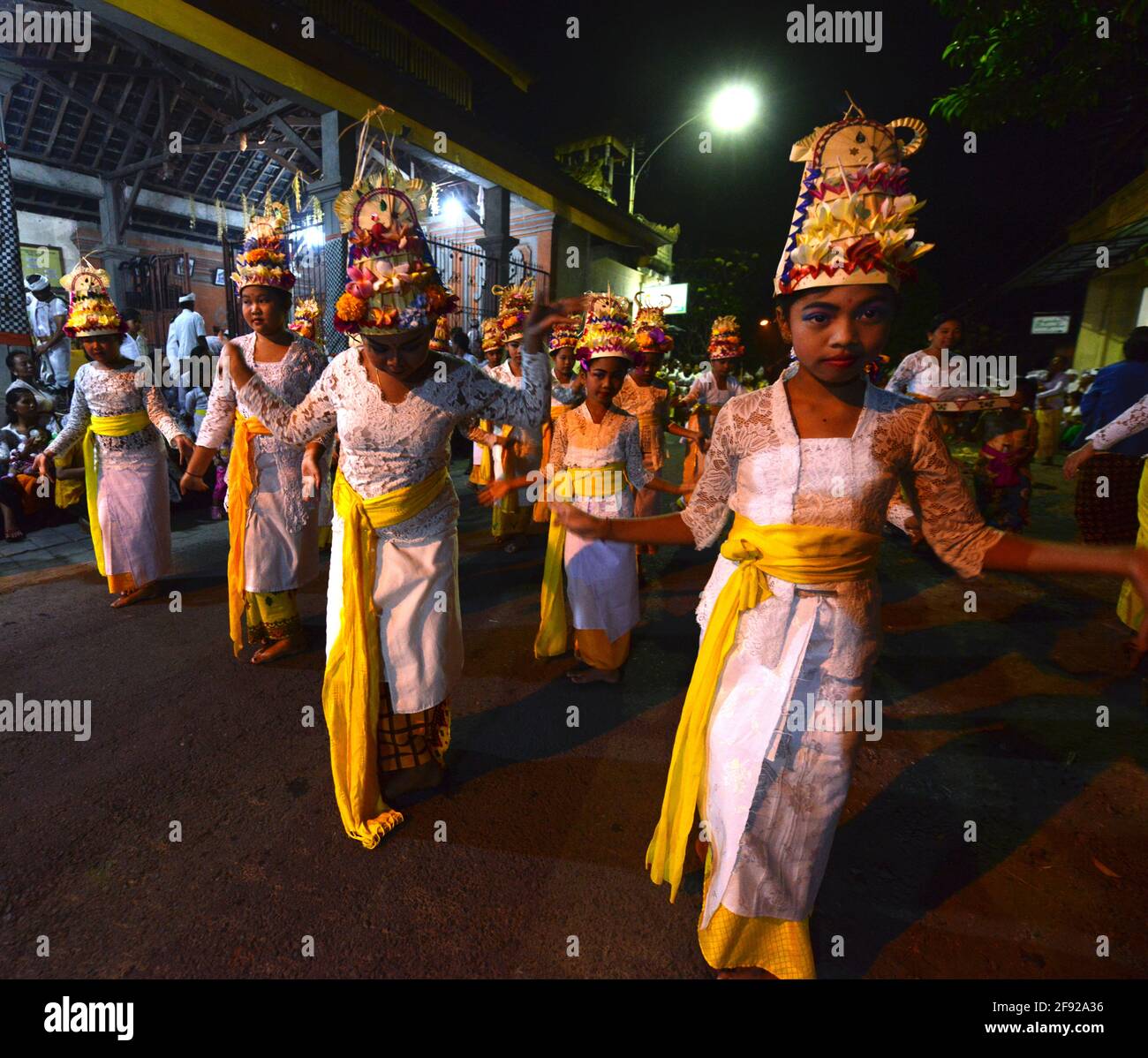 Balinese girl dancers performing at a cultural temple festival in Ubud ...