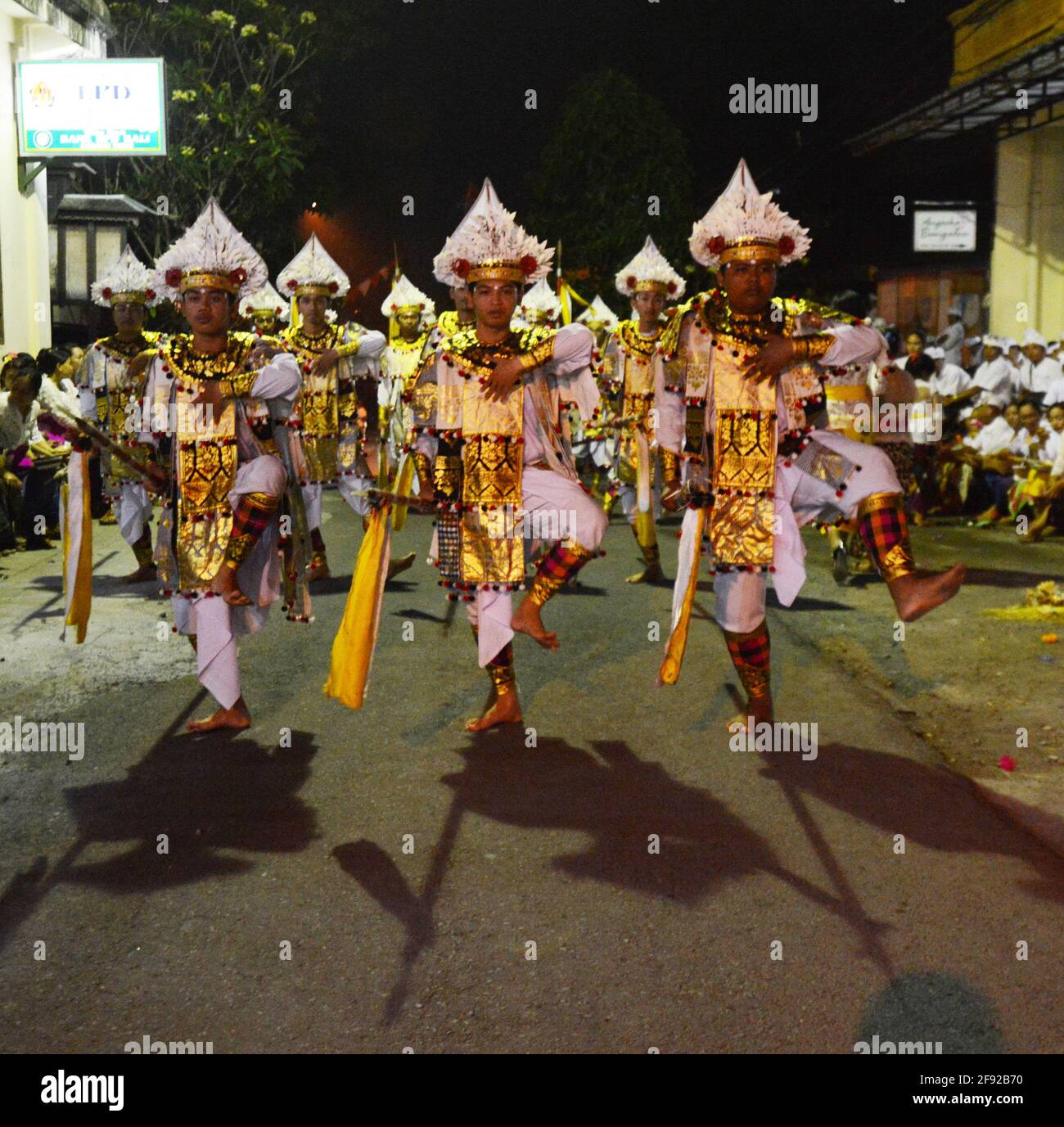 Balinese male dancers dancing during a temple festival in Ubud, Bali ...