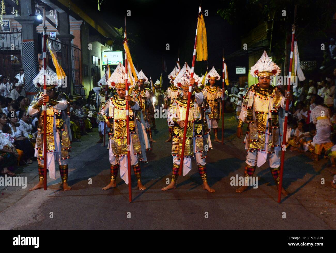 Balinese male dancers dancing during a temple festival in Ubud, Bali ...