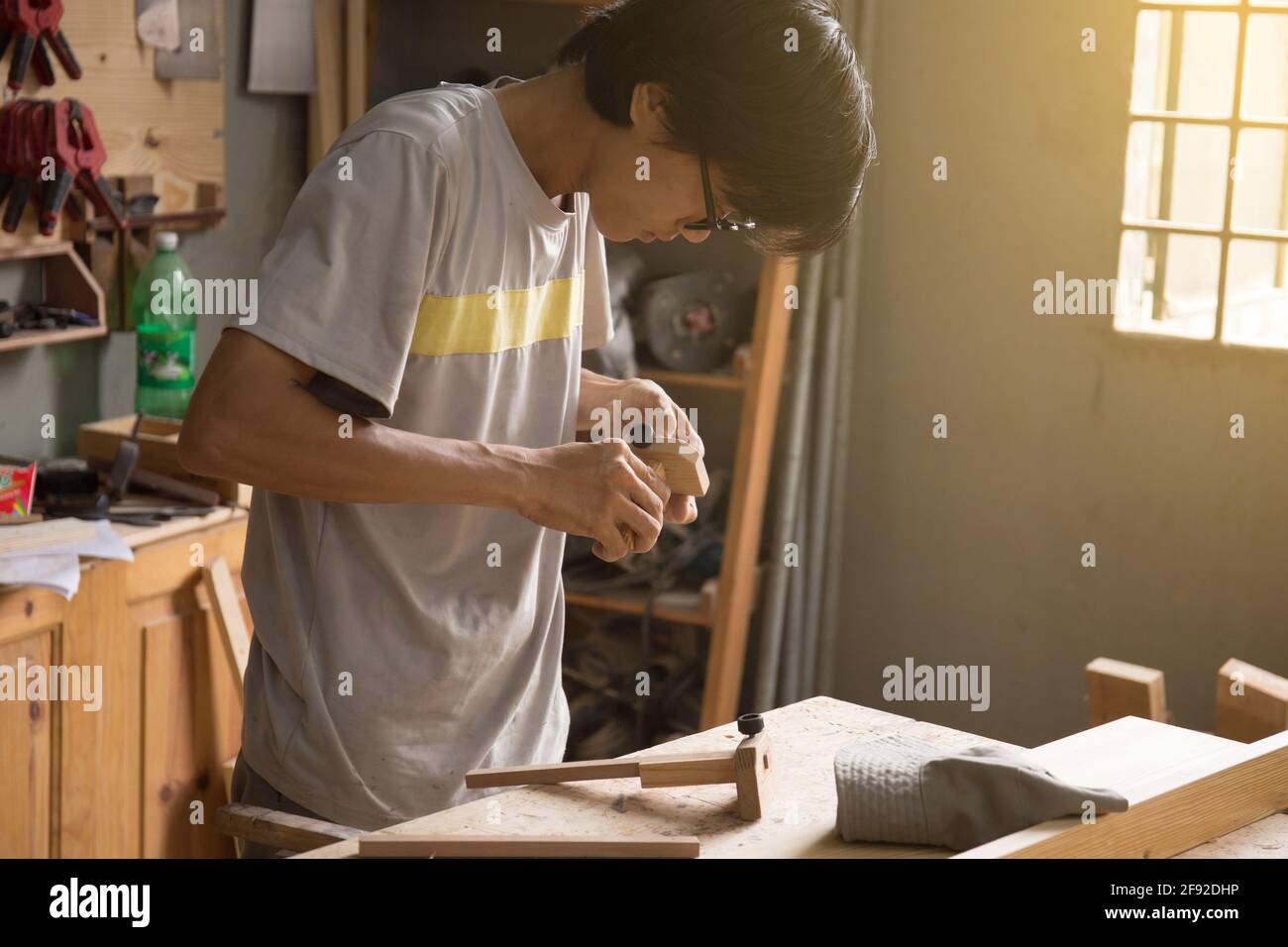 Young Vietnamese male working in the carpentry Stock Photo - Alamy