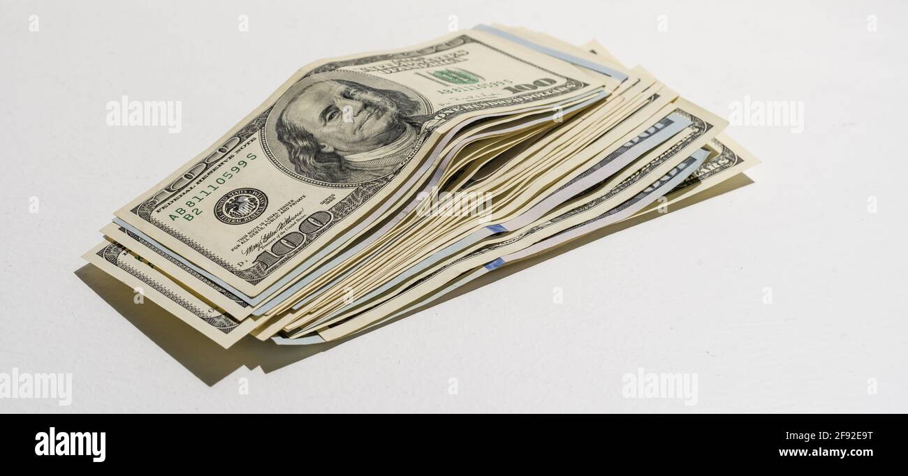 Stack of hundred dollars isolated on white Stock Photo - Alamy