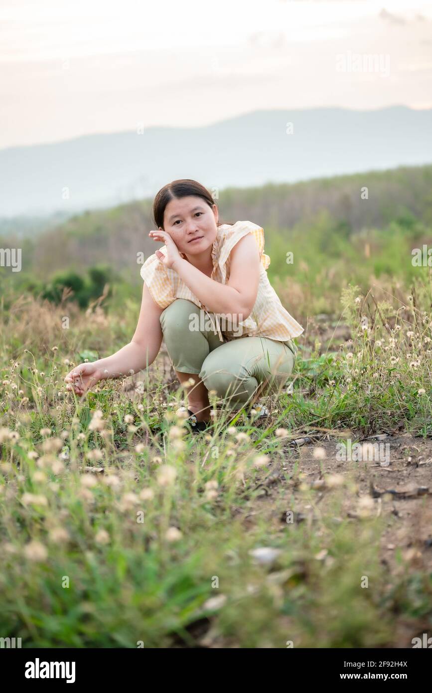 Watching the grass in the sunset Stock Photo - Alamy