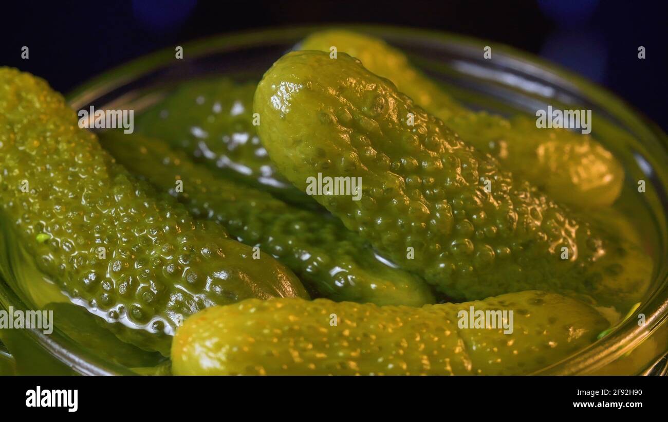 Photo of green gherkin in glass jar, close-up shooting Stock Photo - Alamy