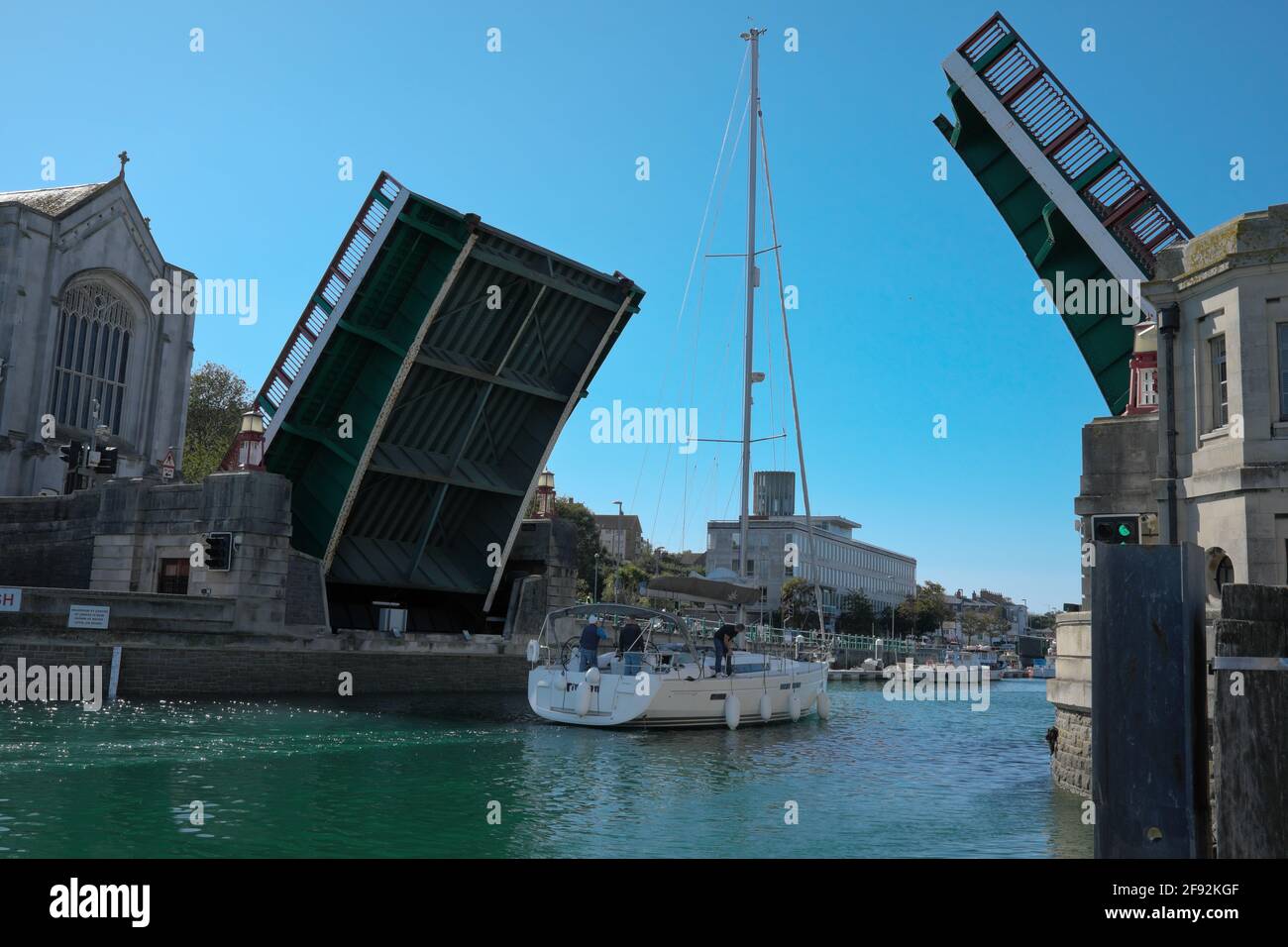 A Boat Passes Through The Opened Bascule Bridge Also Known As Weymouth ...